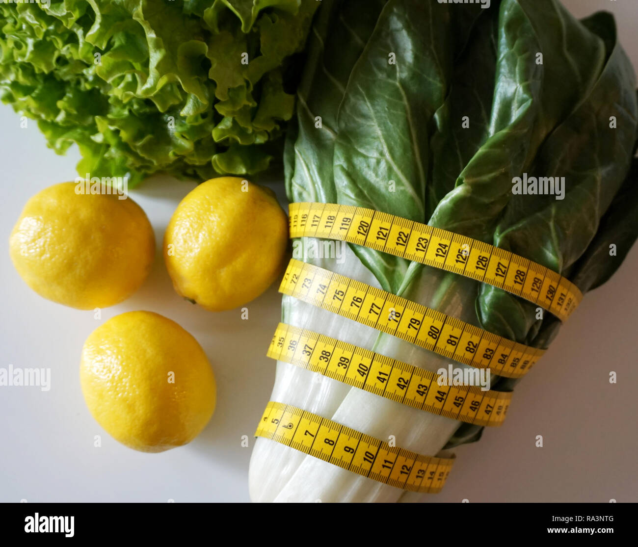 Fresh natural ingredients for salad, lemon, winter lettuce and chard ...