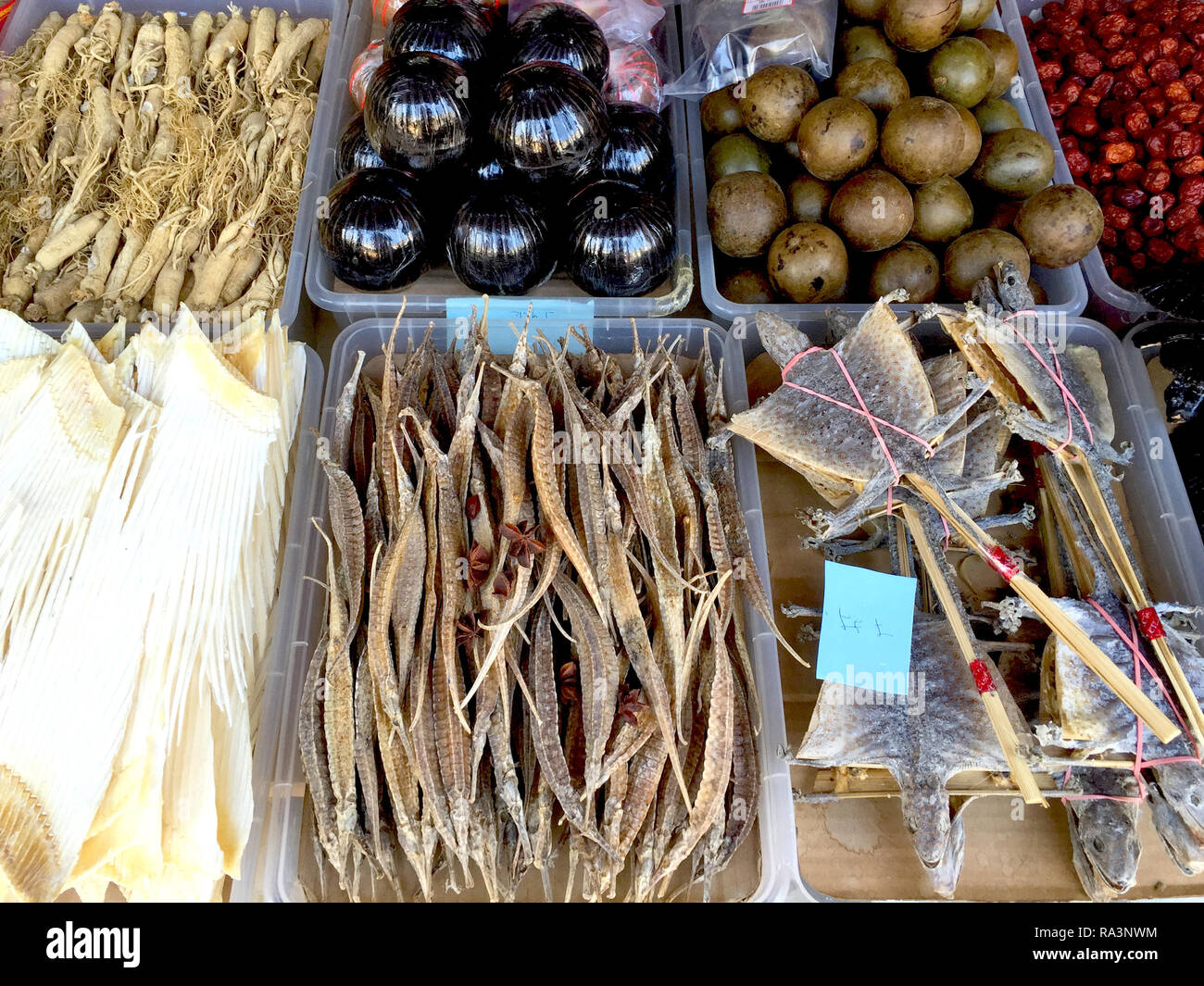 A range of foods fr sale in a Vietnamese market. These include dried ...