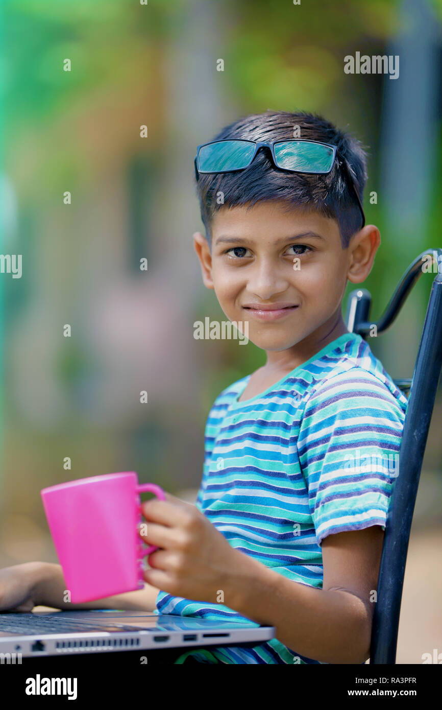 Child working on laptop Stock Photo - Alamy