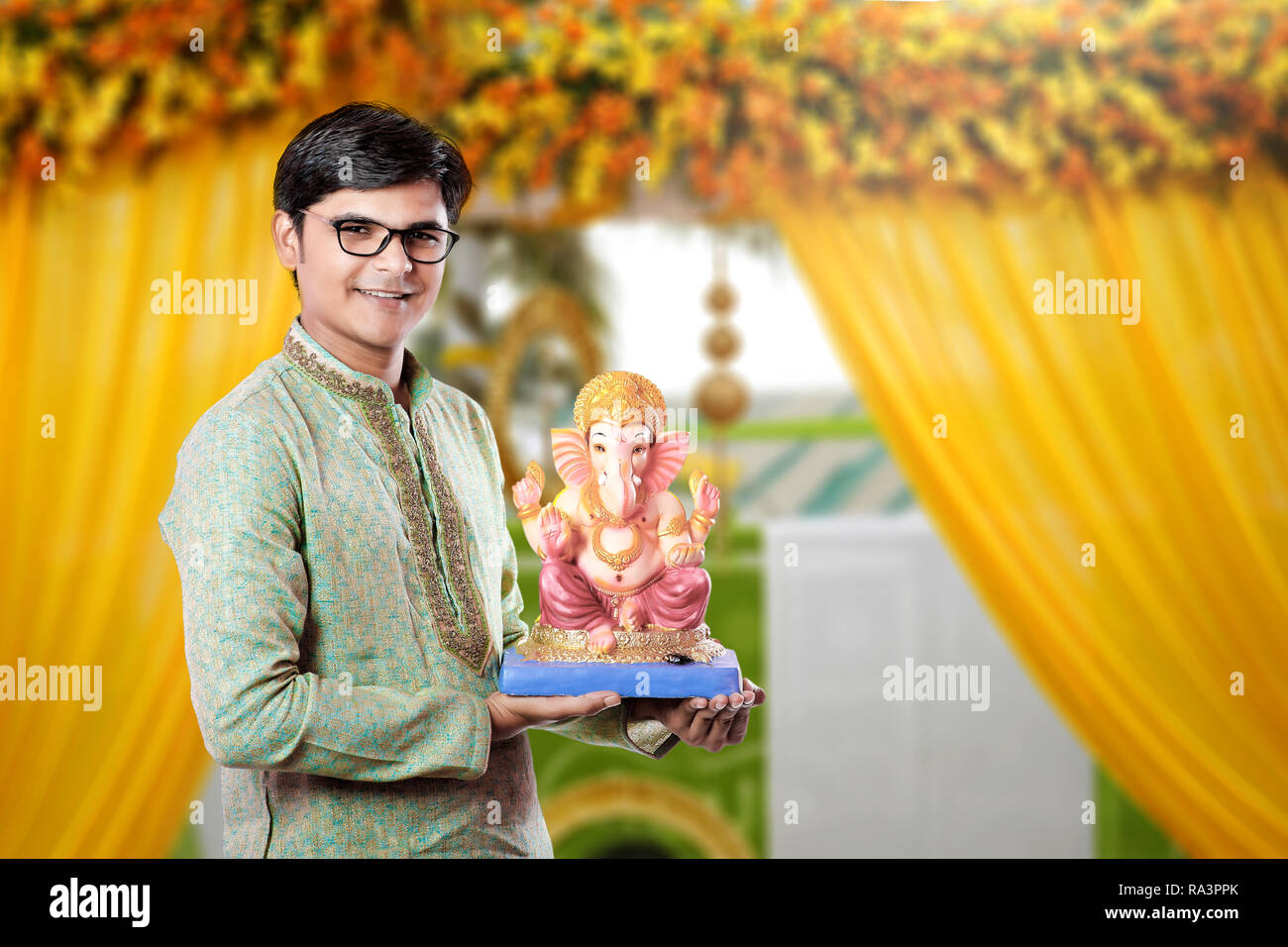 Young Indian man with Lord Ganesha , Celebrating Ganesh festival Stock ...