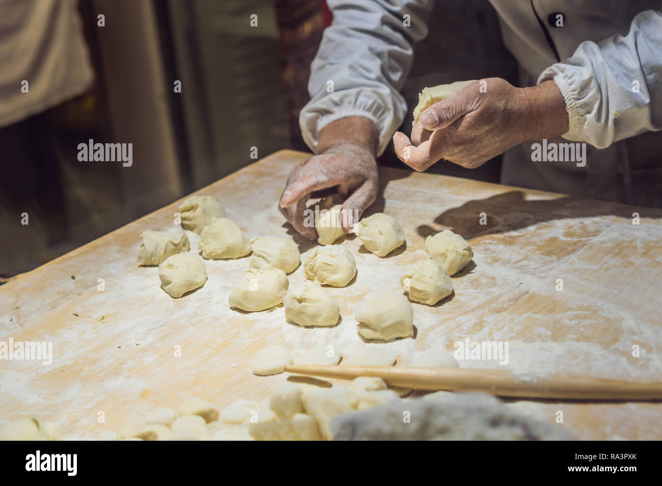Chinese chef making dumplings in the kitchen Stock Photo - Alamy