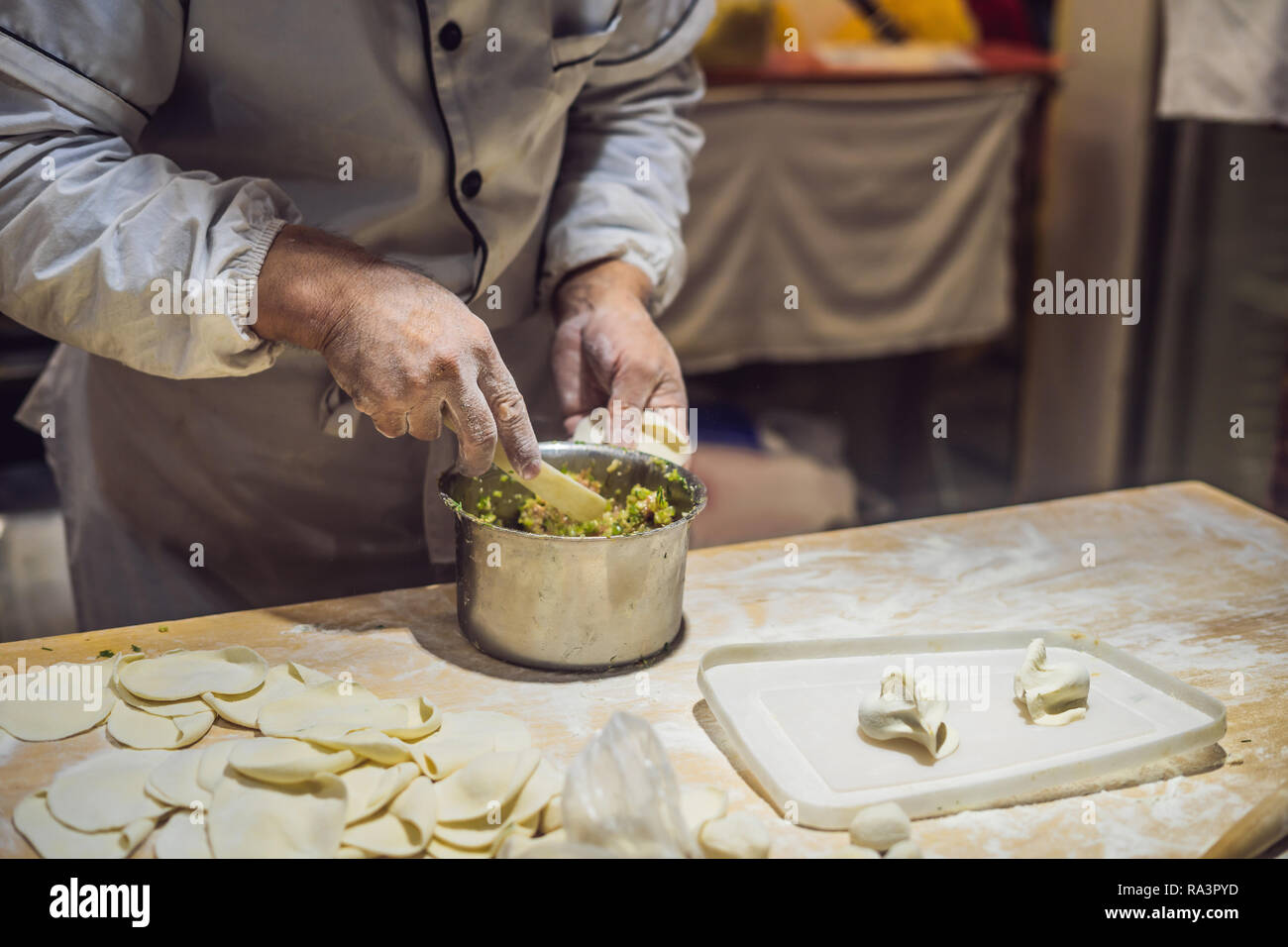 Chinese chef making dumplings in the kitchen Stock Photo - Alamy