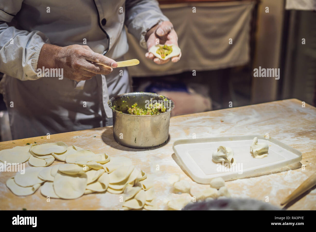 Chinese chef making dumplings in the kitchen Stock Photo - Alamy