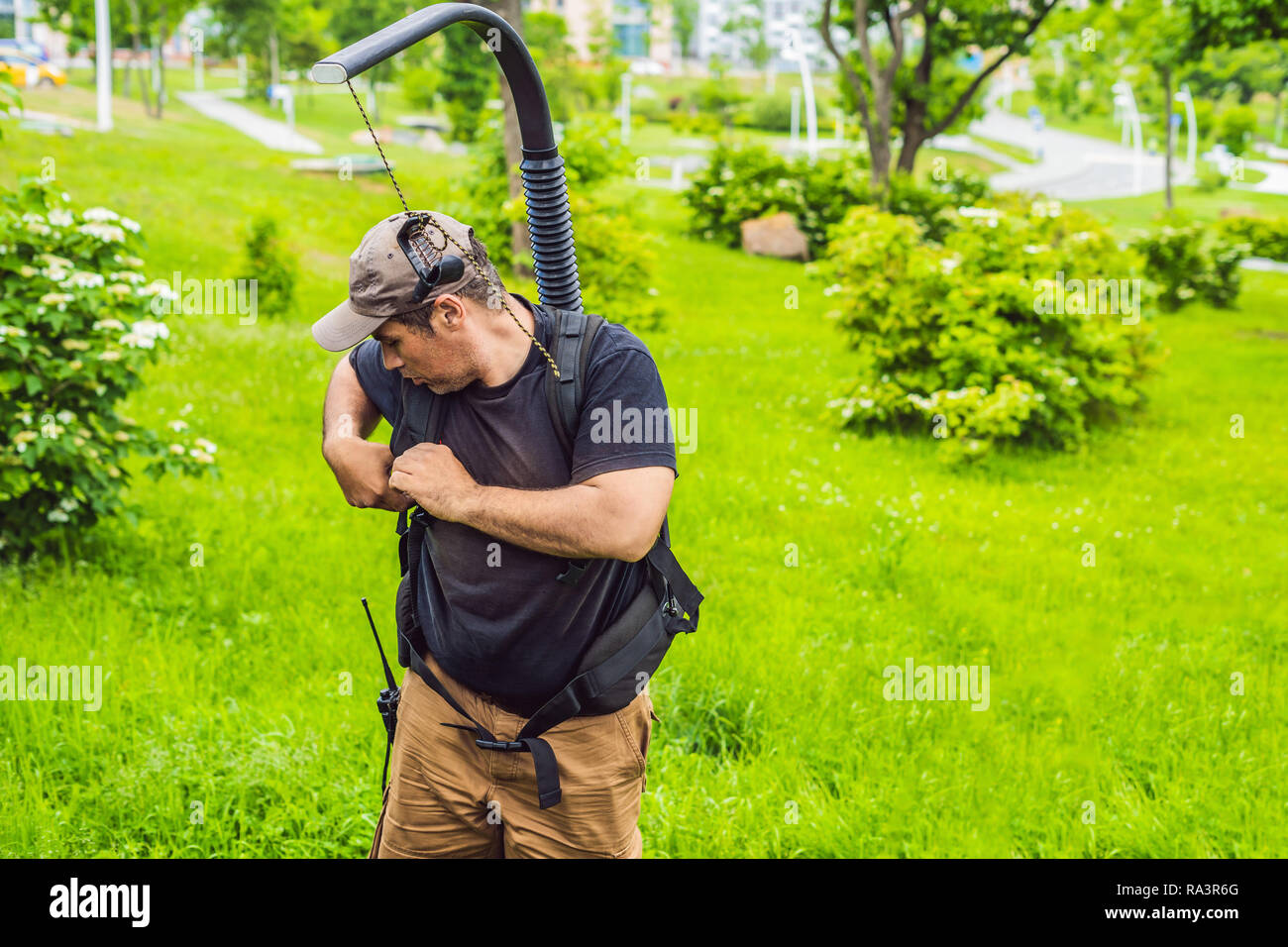 Cameraman setting up heavy duty professional 3-axis gimbal stabilizer ... Cameraman setting up heavy duty professional 3-axis gimbal stabilizer ...
