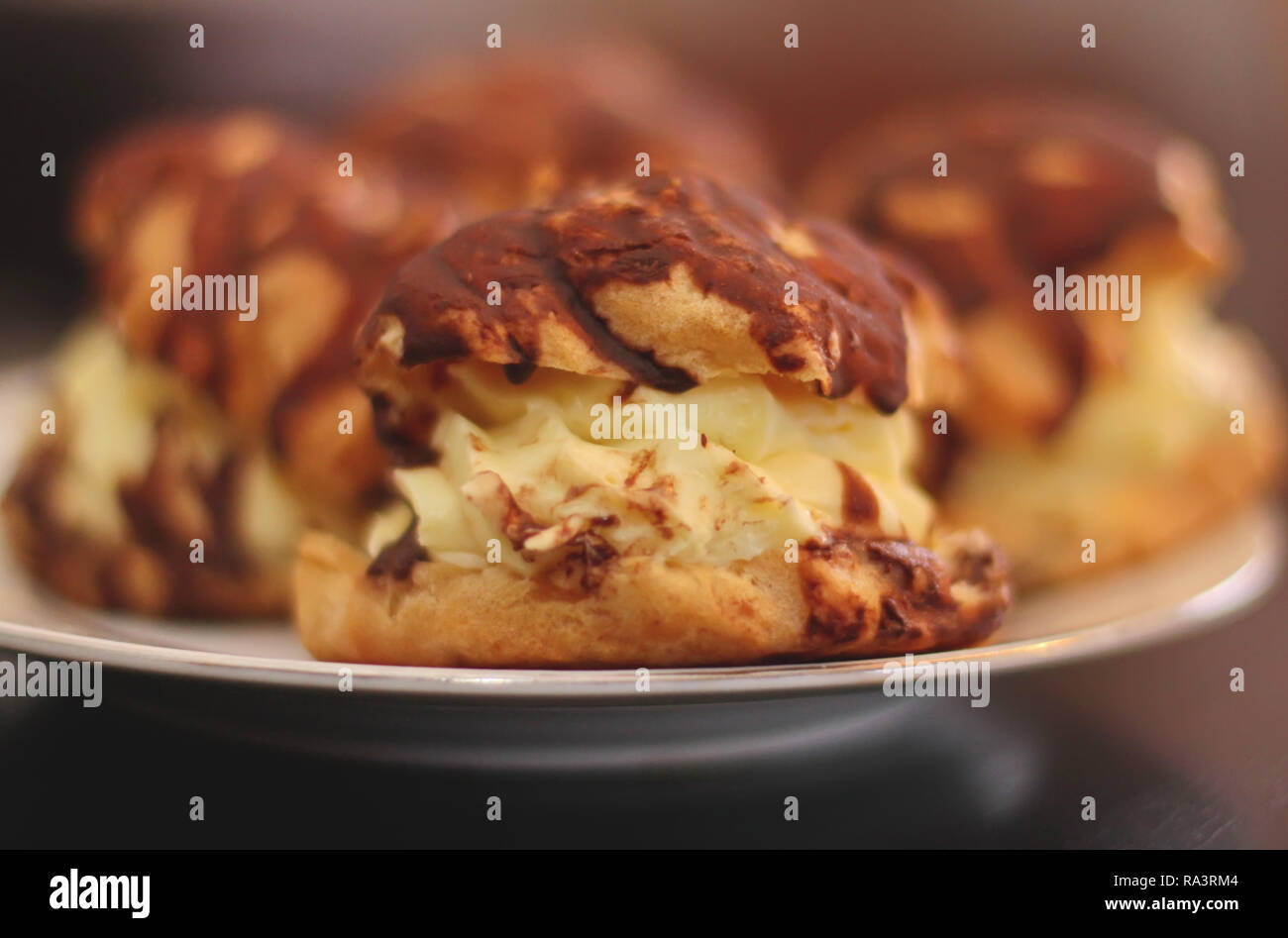 Cream puffs dessert Stock Photo - Alamy