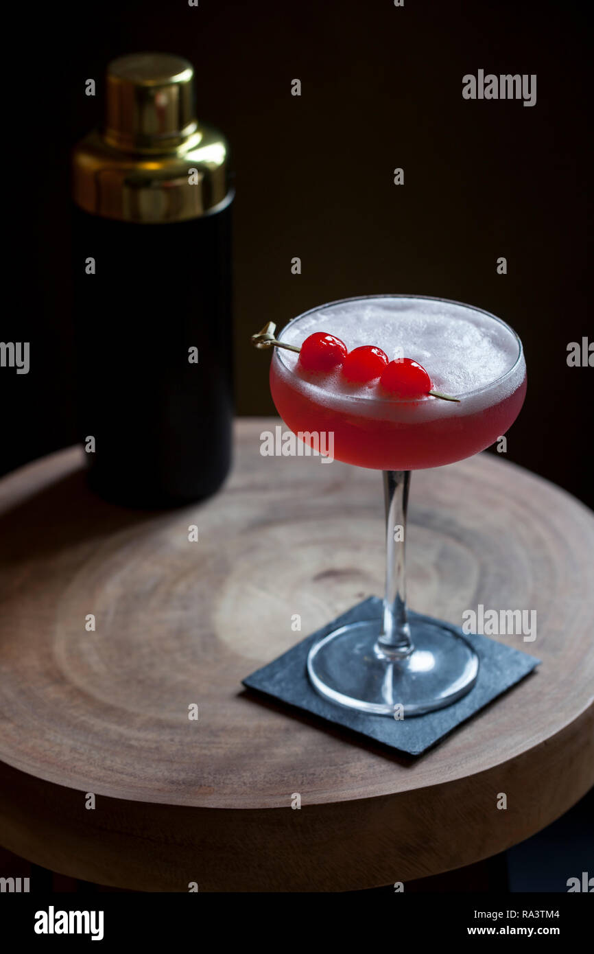 Raspberry cocktail in coup glass Stock Photo - Alamy