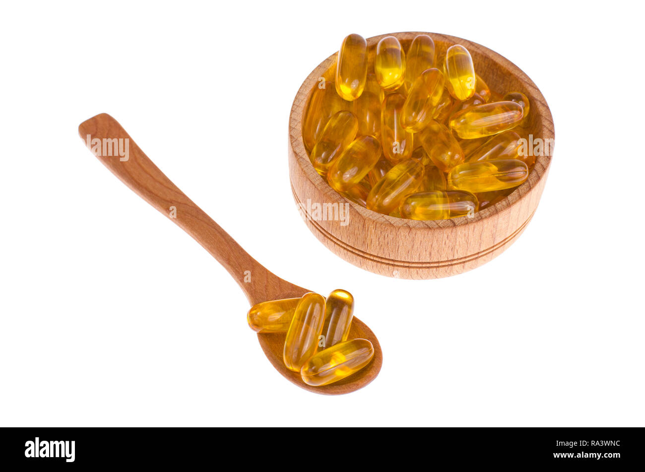 Yellow vitamin soft gelatin capsules with oily drug and nutritional ...