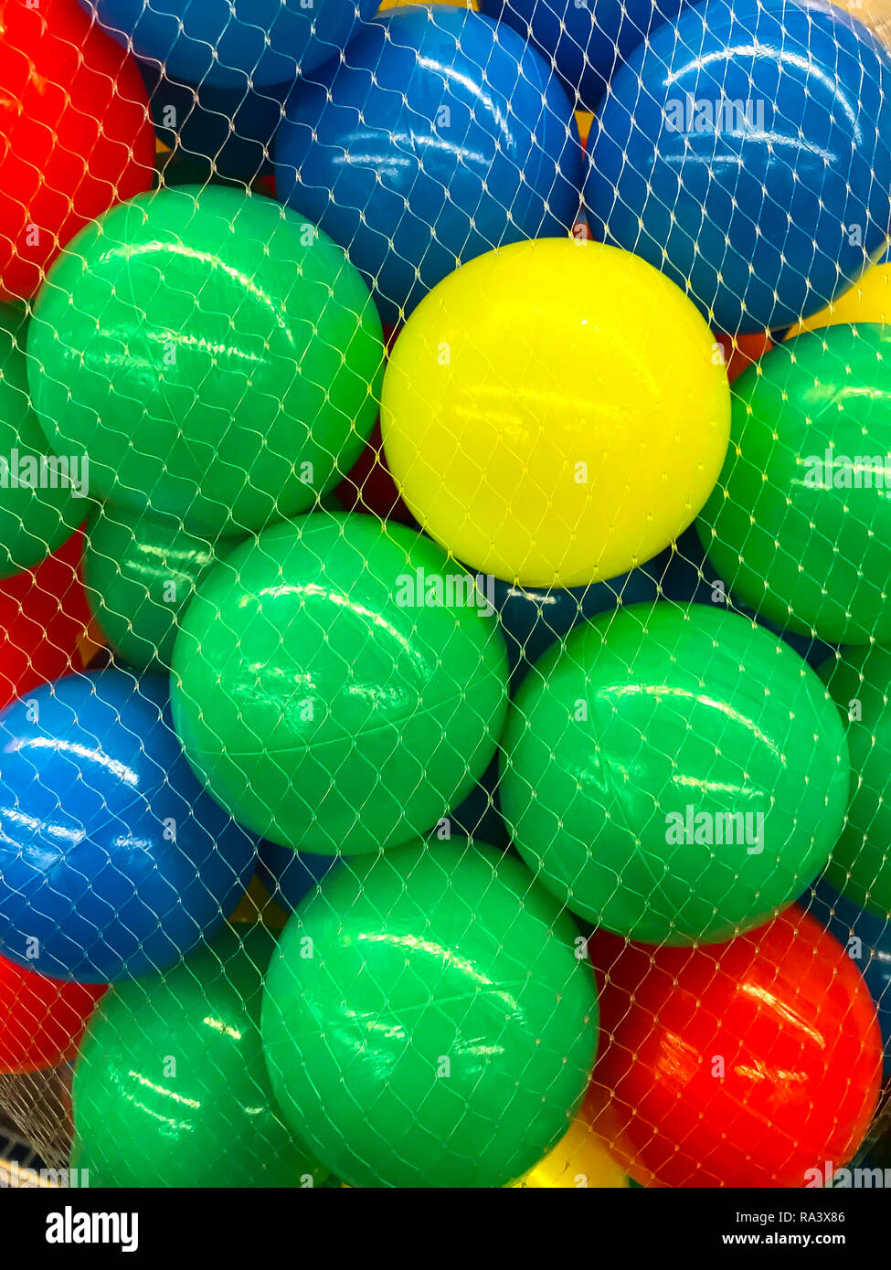 Plastic colored balls in grid. Studio Photo Stock Photo - Alamy