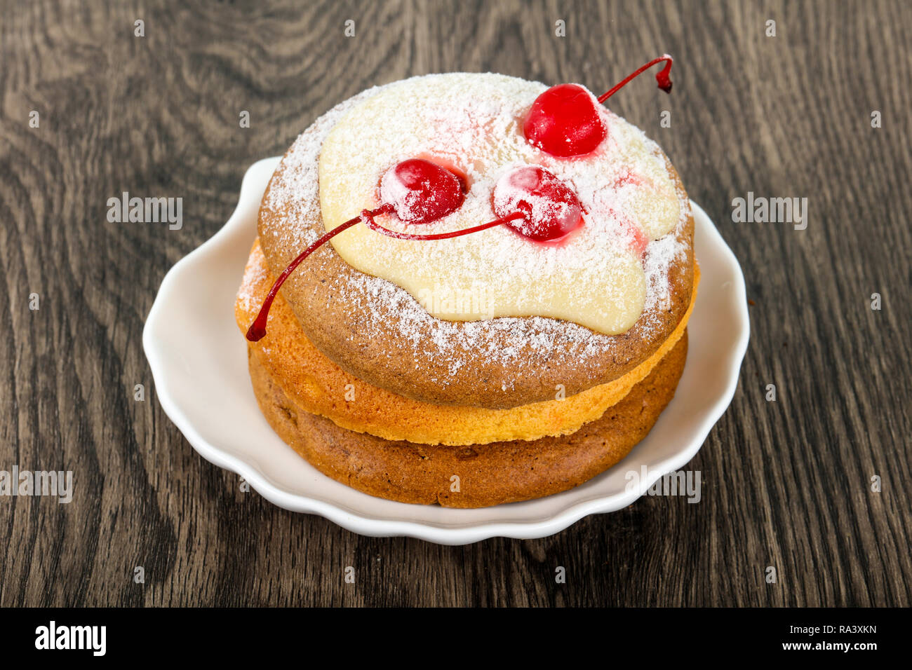 Pancake with cherry and shugar powder Stock Photo - Alamy