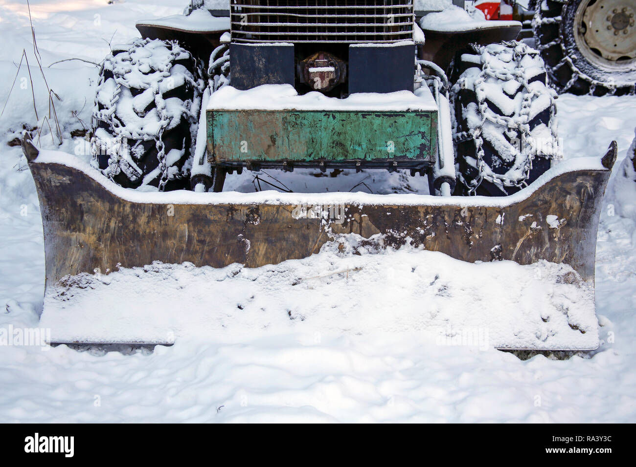 old plough tractor covered with snow in the forest Stock Photo - Alamy