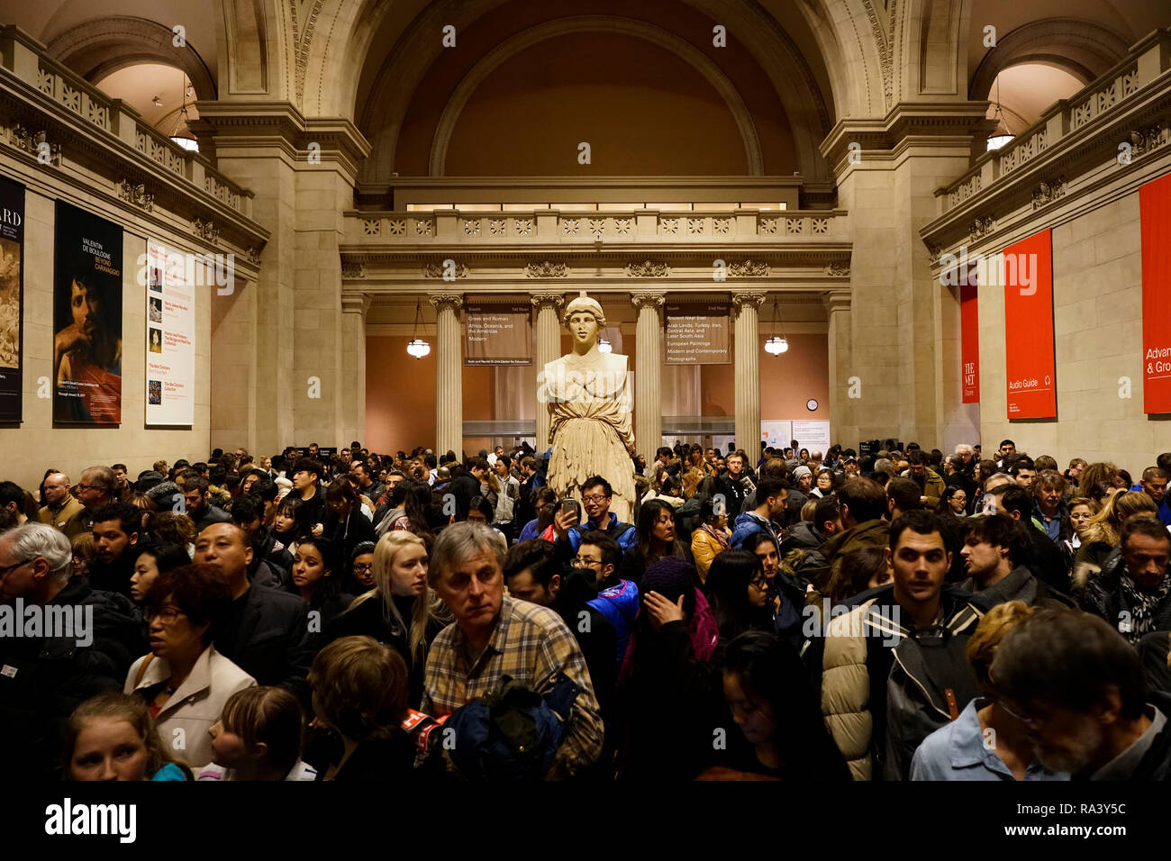 Large crowd of visitors in the entrance hall of the Metropolitan Museum ...