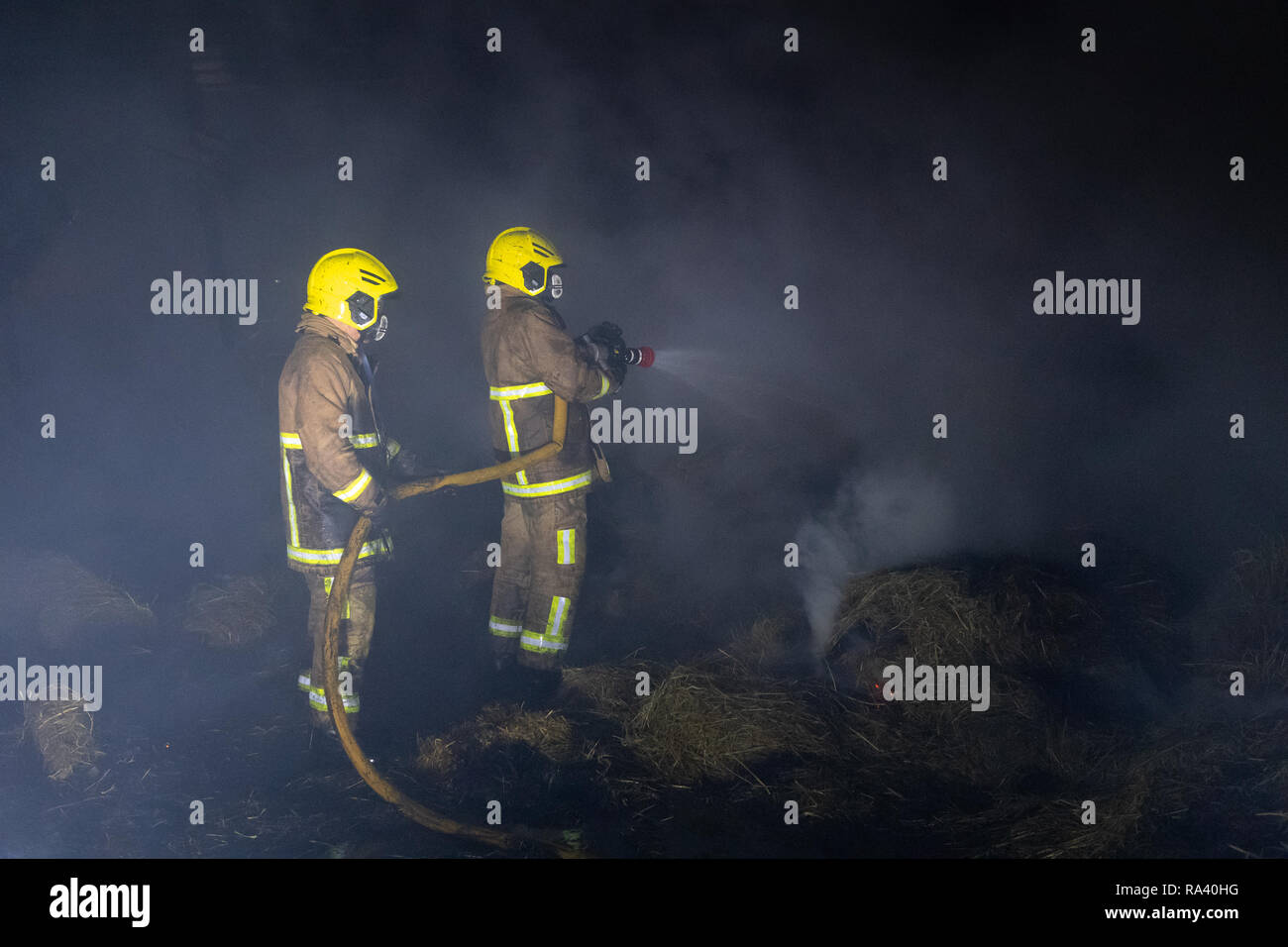Fire crew attending a barn fire, Cumbria, UK Stock Photo - Alamy