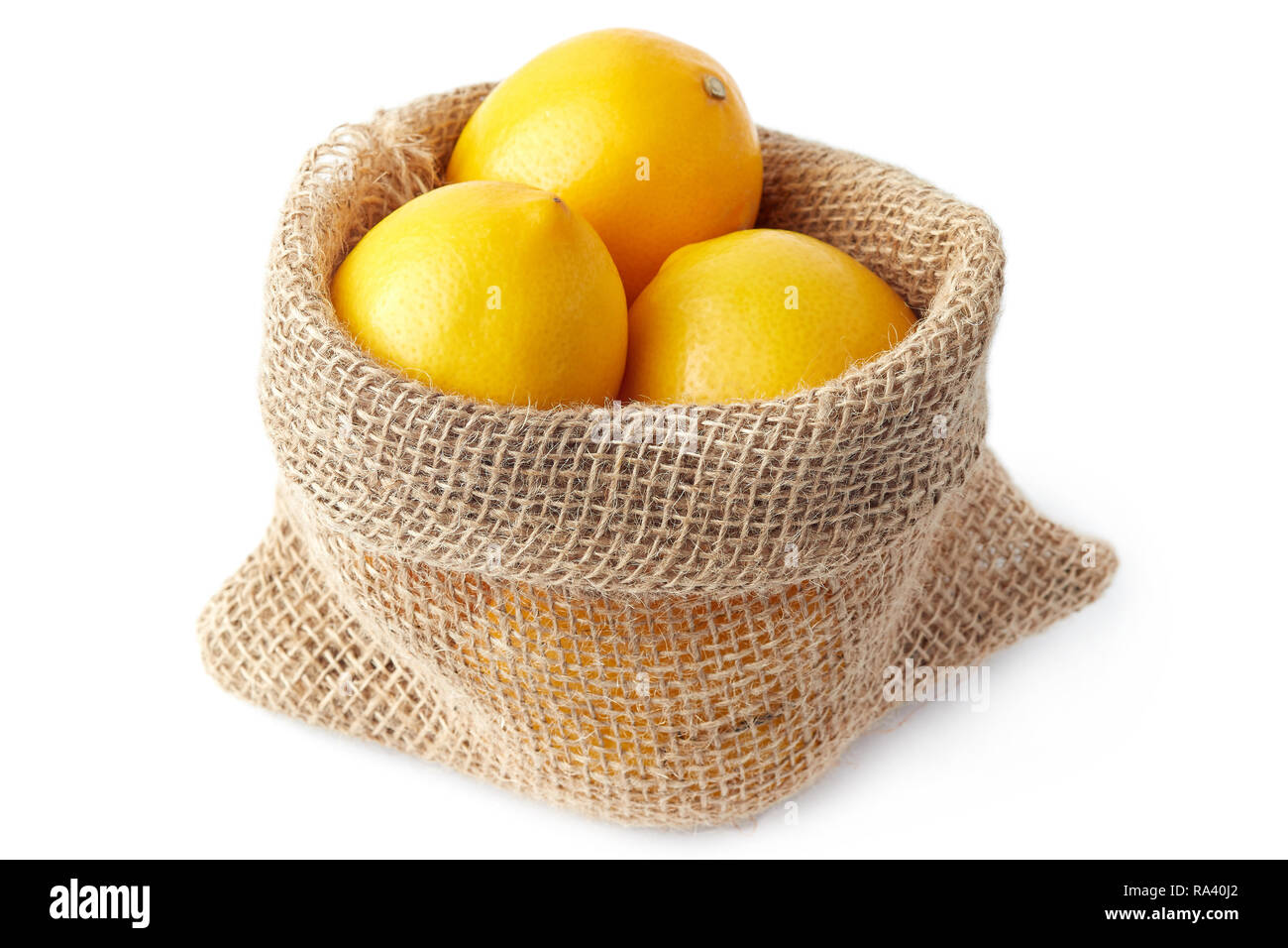 Lemons in burlap sack isolated on white background Stock Photo - Alamy