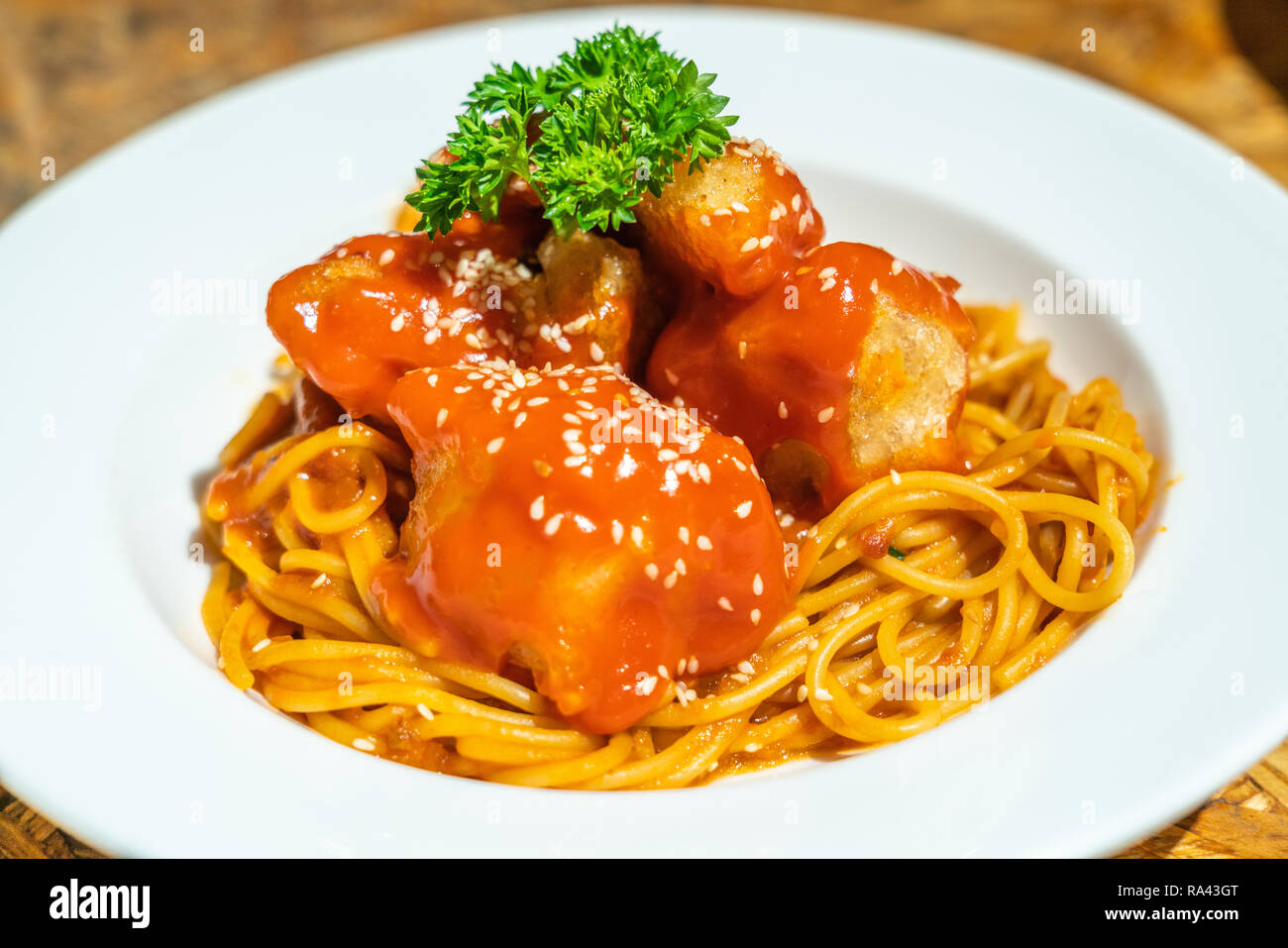 Spaghetti fried chicken cubes with tomato sauce Stock Photo - Alamy