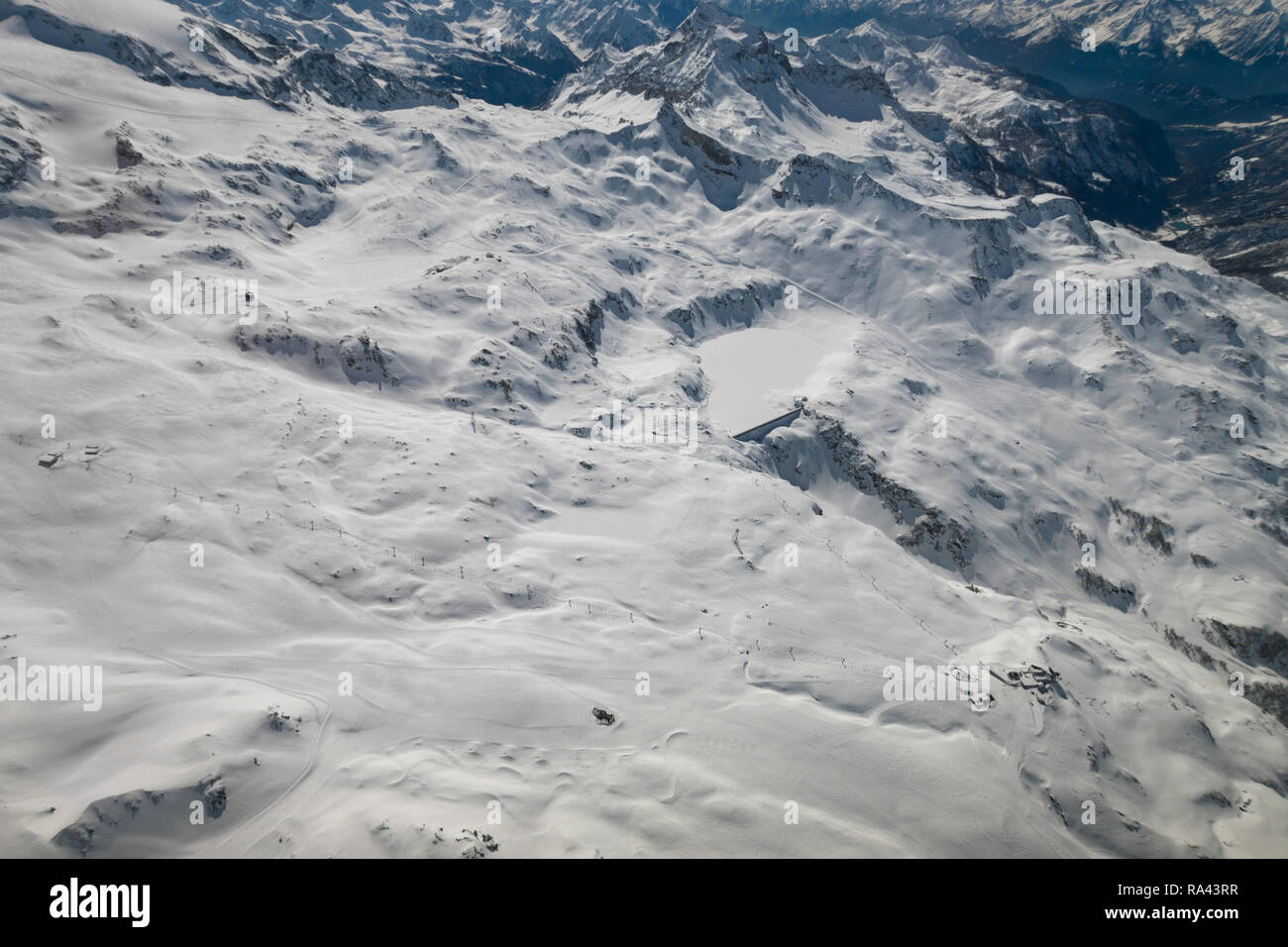 Aerial view of snow covered landscape in the ski region of Breuil ...