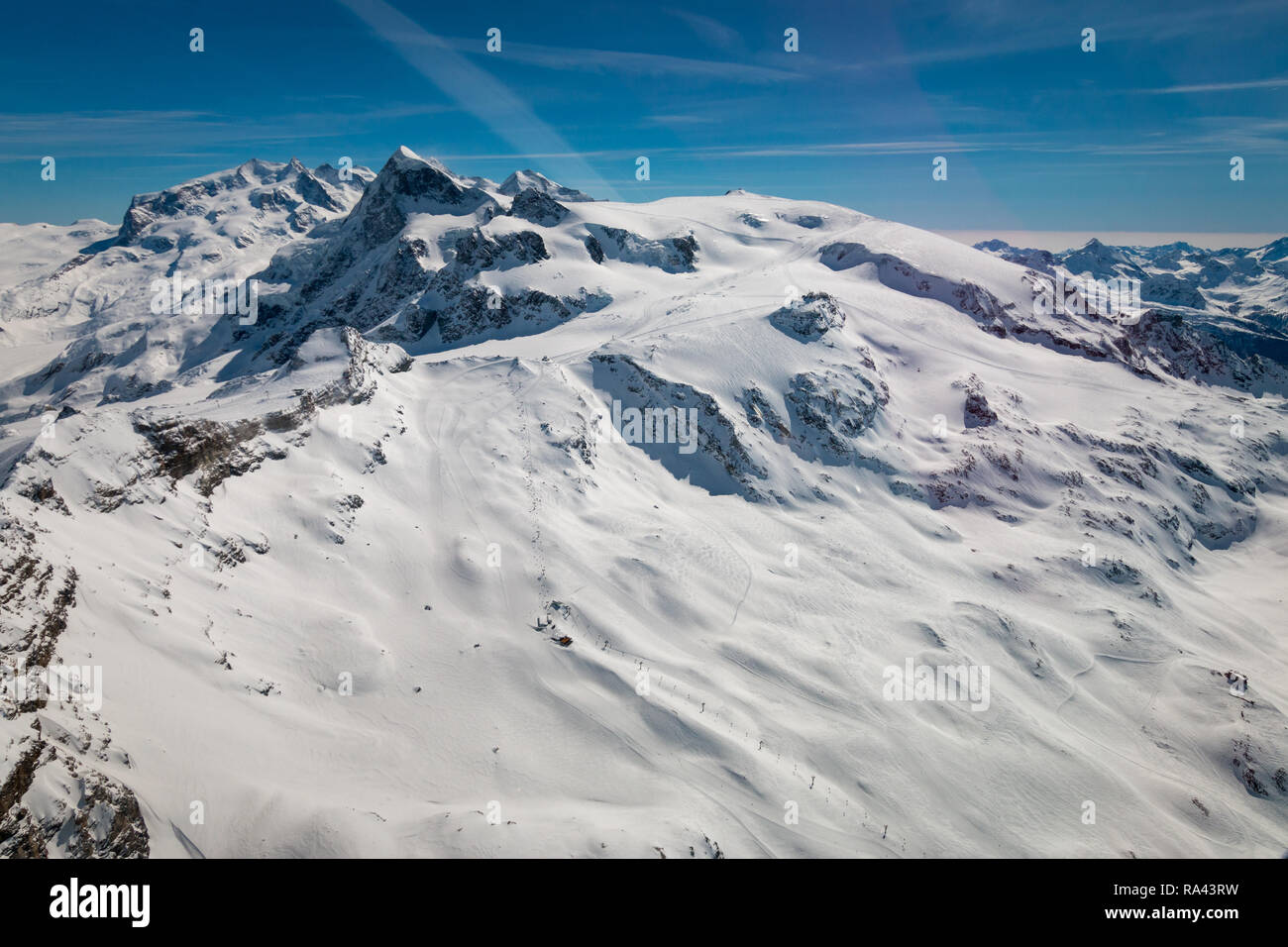 Aerial view of snow covered landscape in the ski region of Zermatt and ...