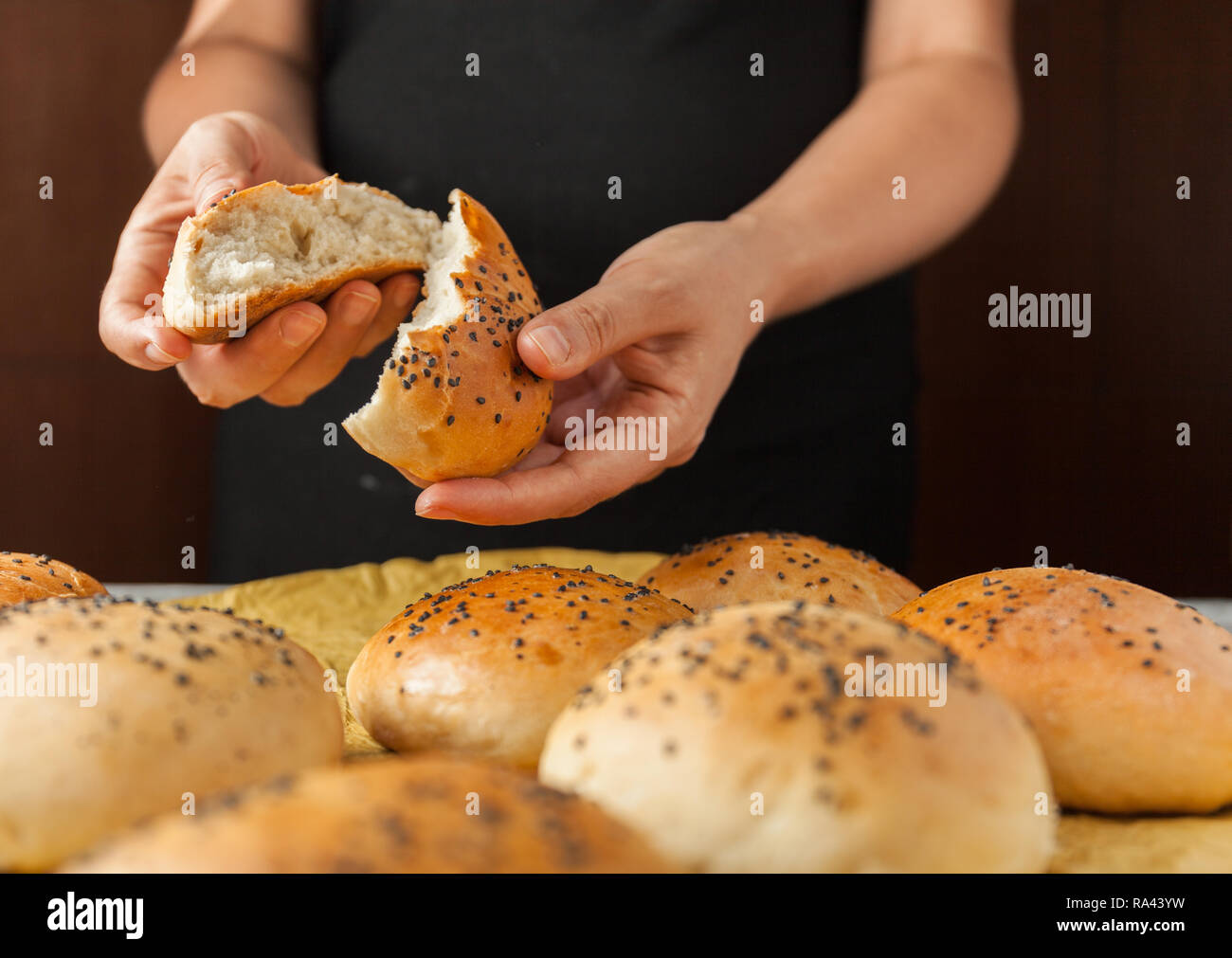 Hands holding loaf bread in hi-res stock photography and images - Alamy