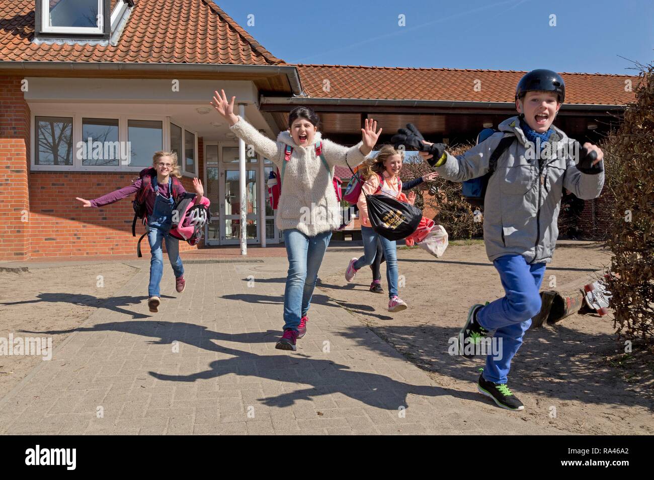 Students running out school building hi-res stock photography and ...