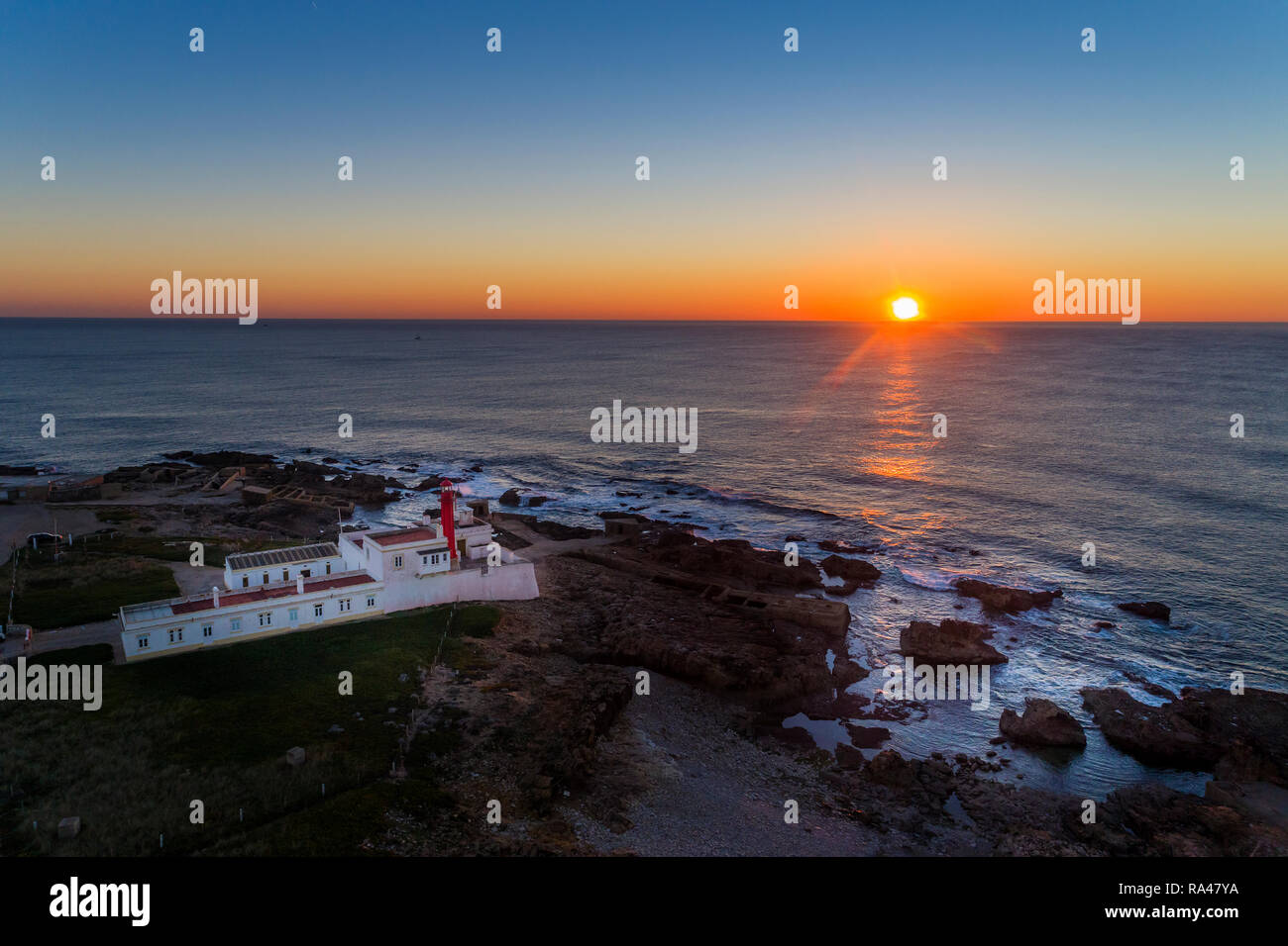 Aerial view of the Cabo Raso lighthouse near Cascais at sunset; Concept ...