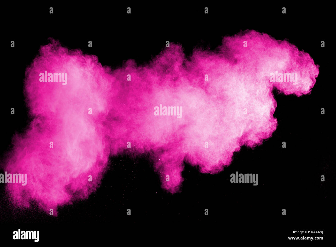 Abstract pink powder splatter on black background.Freeze motion of pink ...