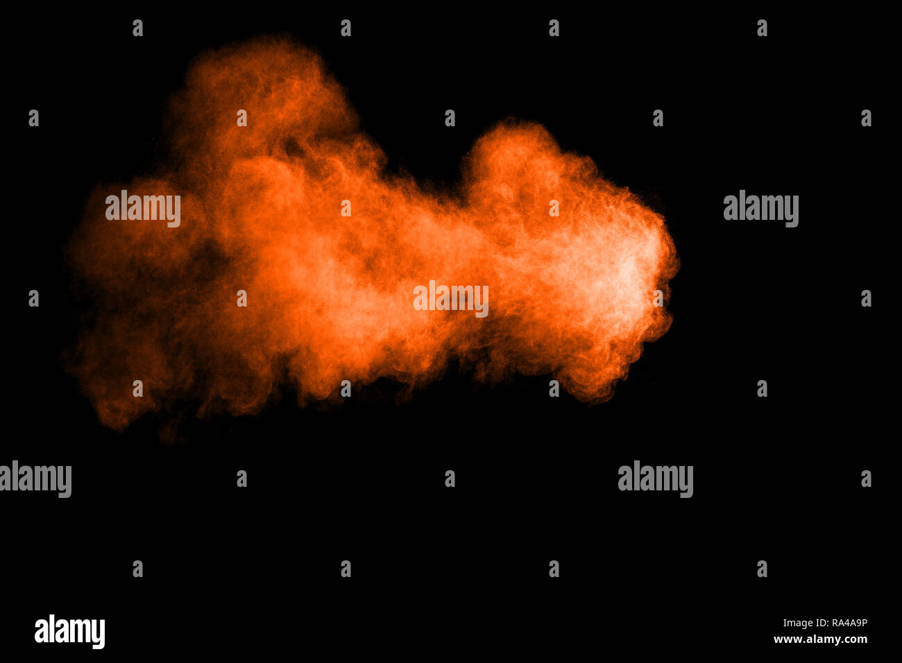 abstract orange dust explosion on black background. abstract orange ...