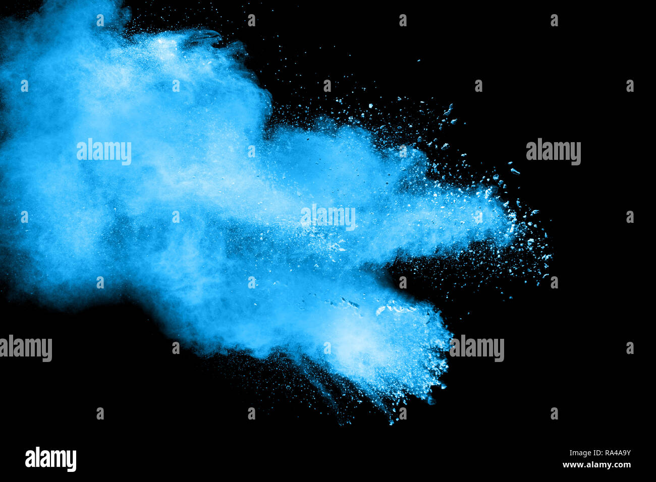 abstract blue dust explosion on black background .abstract blue powder ...