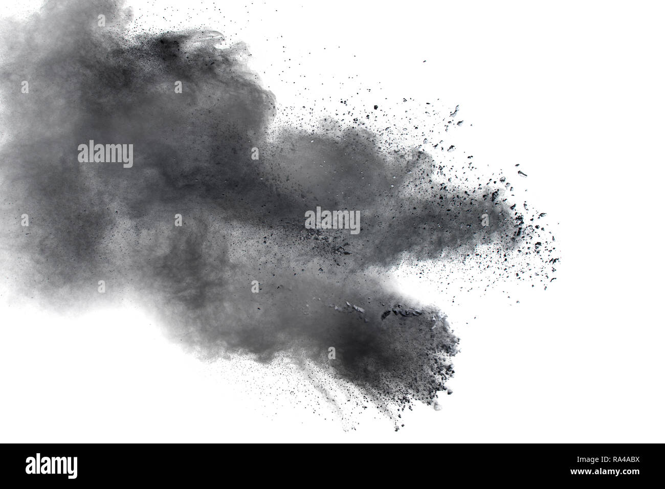 Black powder explosion. The particles of charcoal splatter on white ...