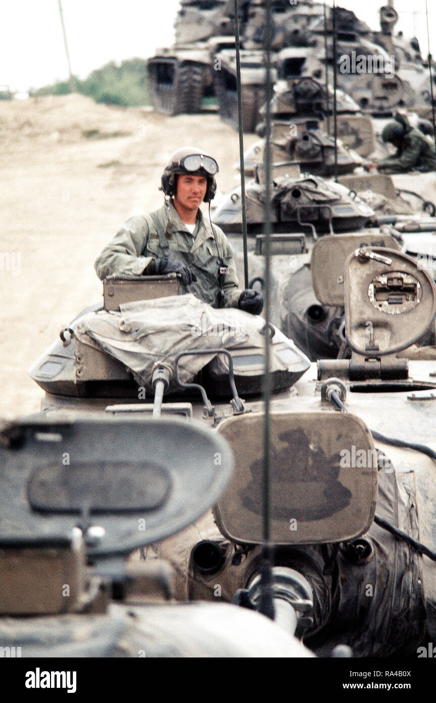 1977 - A gunner on an M-60 main battle tank looks out a turret during ...