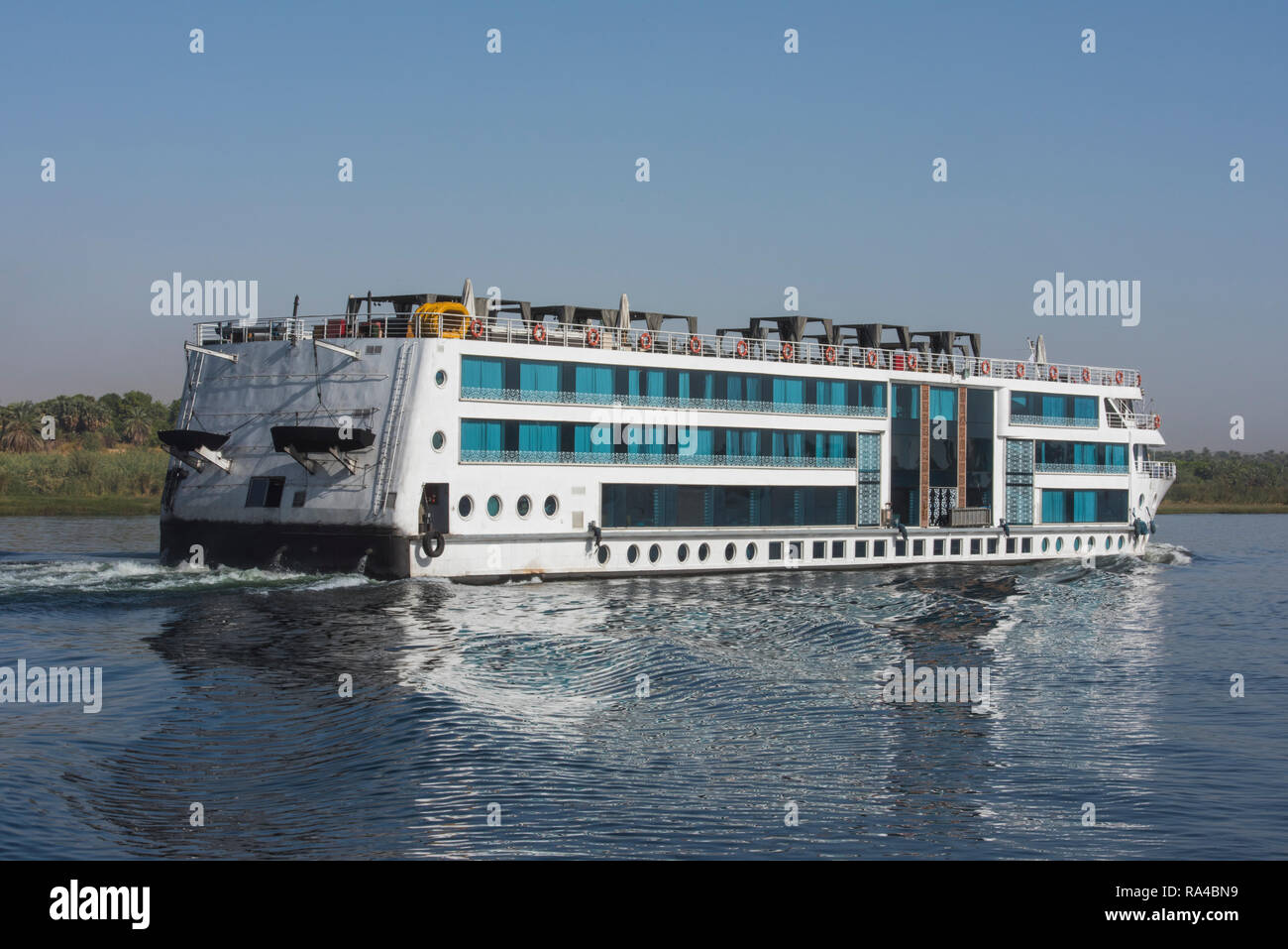 Large luxury traditional Egyptian river cruise boat sailing on the Nile ...