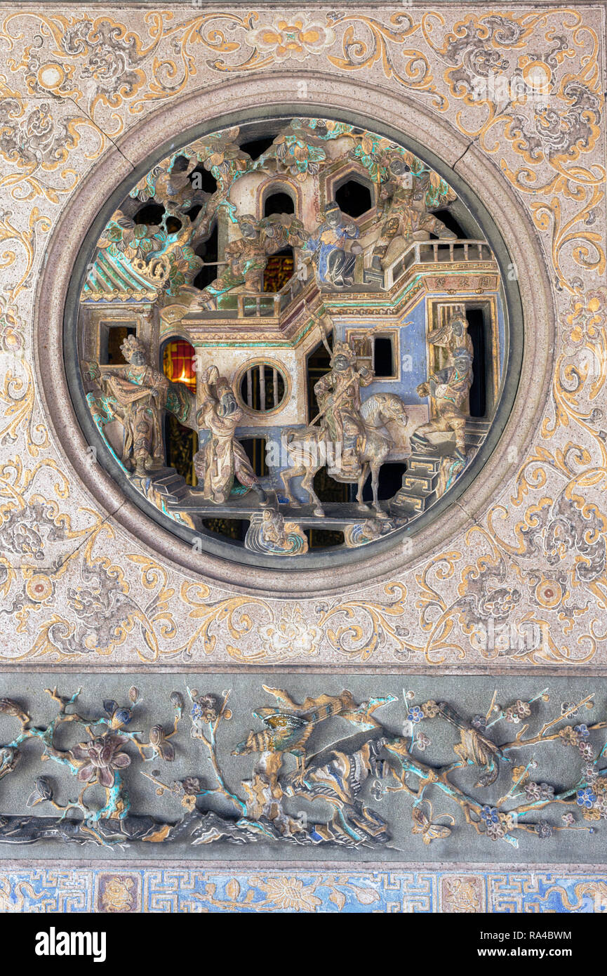 big round stone windows on the wall of the basement of in Leong San ...