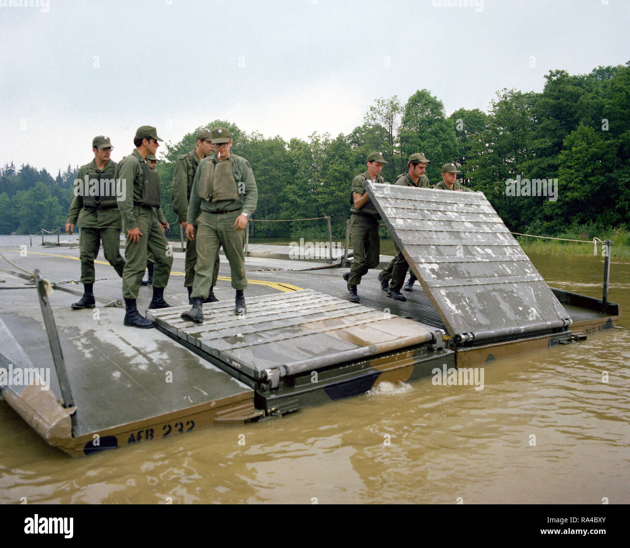 A ribbon bridge is assembled by members of the 1457th Engineering ...