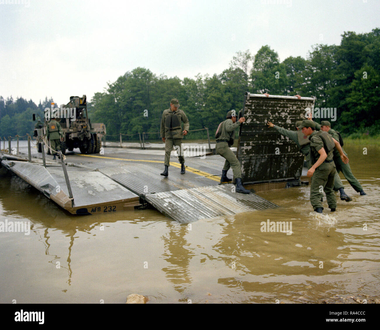1978 - A ribbon bridge is assembled by members of the 1457th Engineer ...