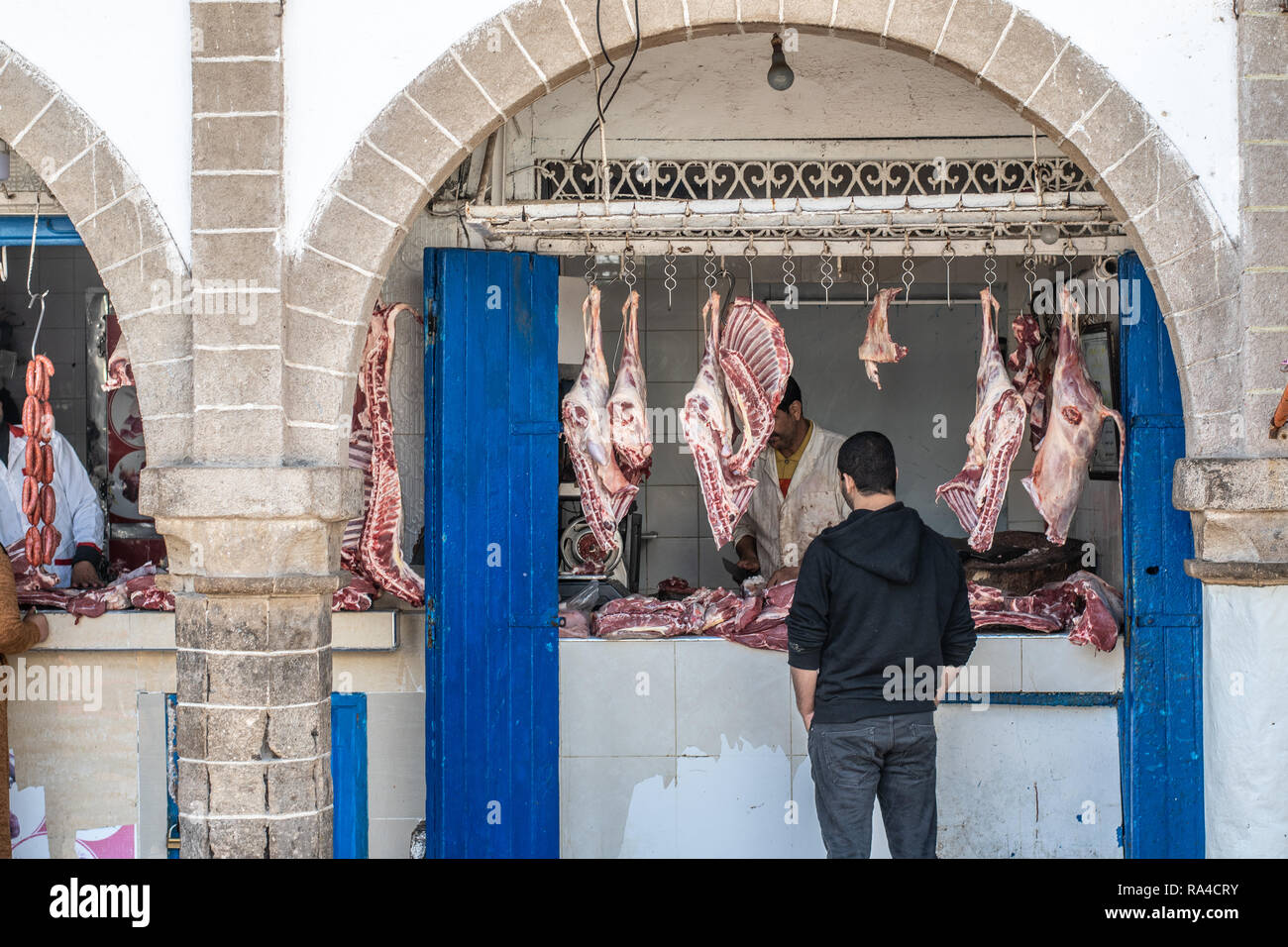 Meat hanging in market hi-res stock photography and images - Alamy