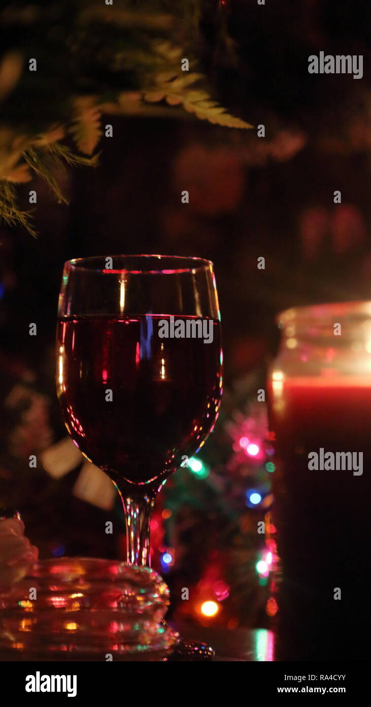 lit by candle and Christmas lights Stock Photo - Alamy