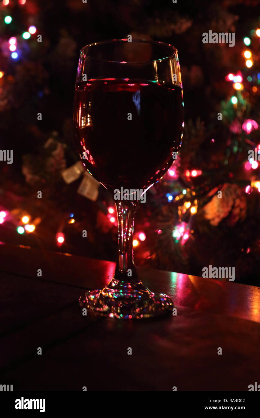 lit by candle and Christmas lights Stock Photo - Alamy