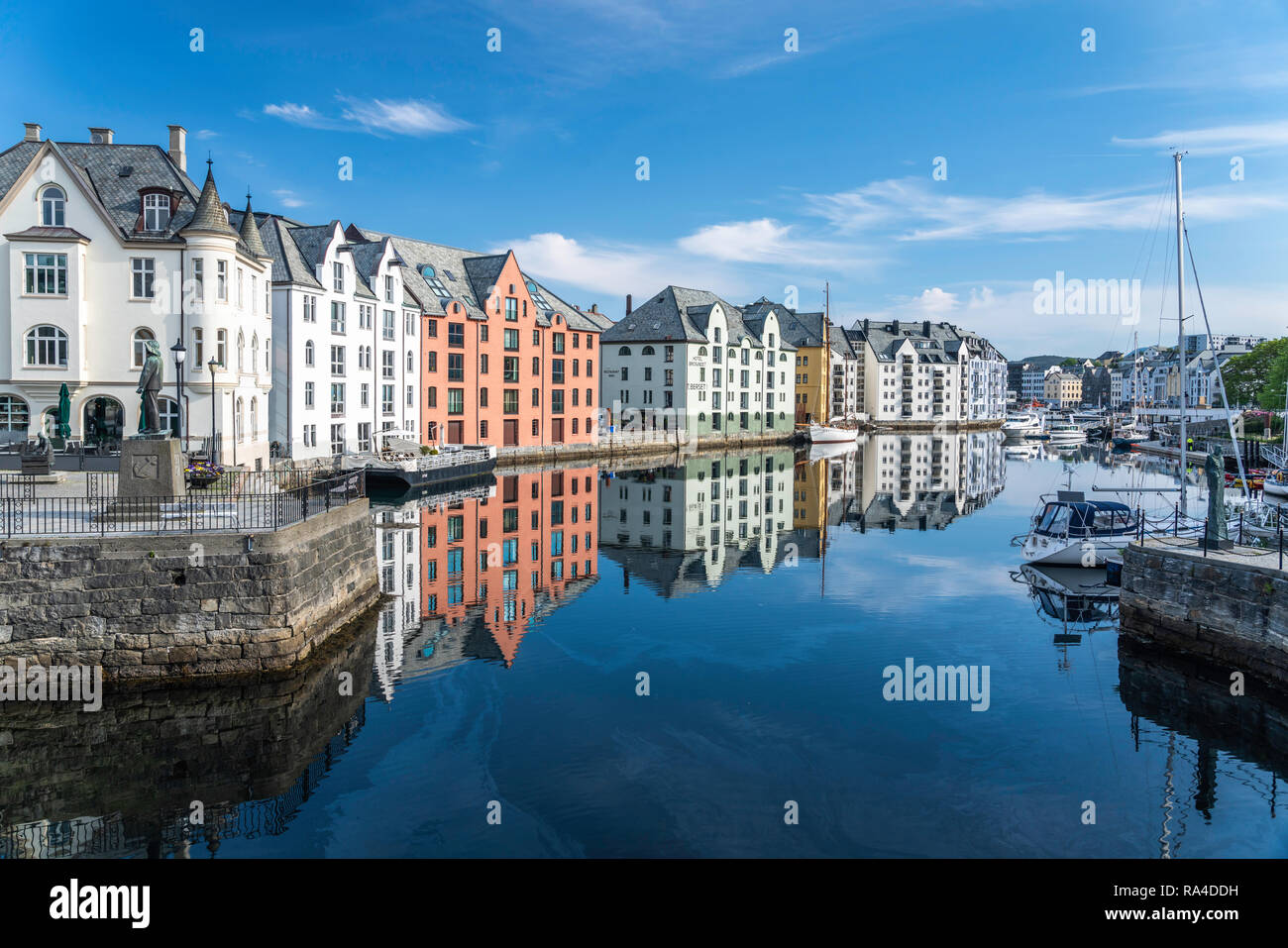 Reflections of buildings in the Art Nouveau Town of Ålesund, Norway ...
