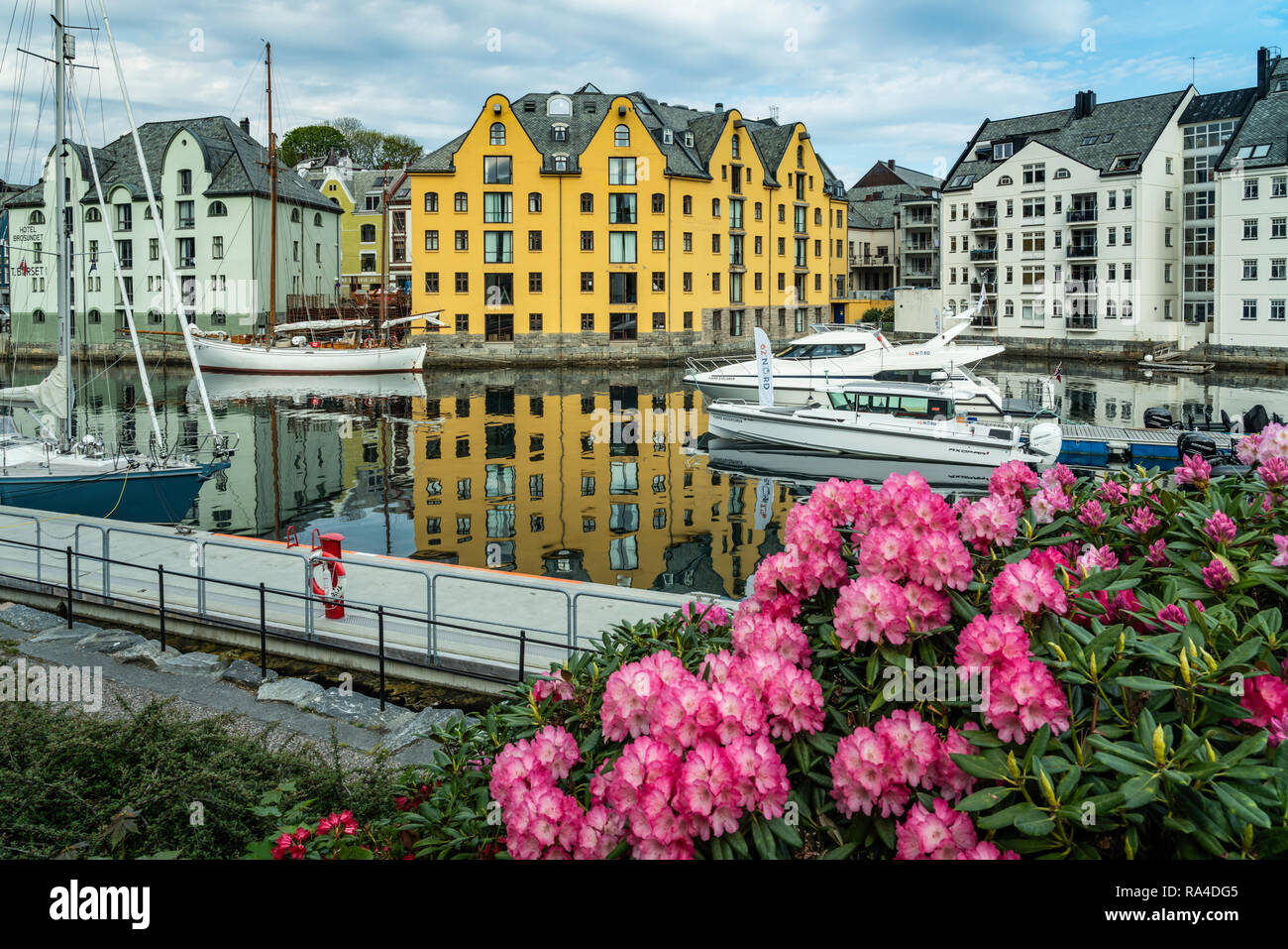 Reflections of buildings in the Art Nouveau Town of Ålesund, Norway ...
