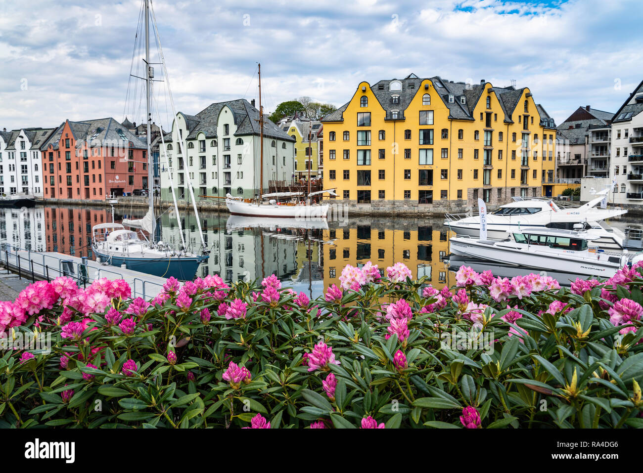 Reflections of buildings in the Art Nouveau Town of Ålesund, Norway ...
