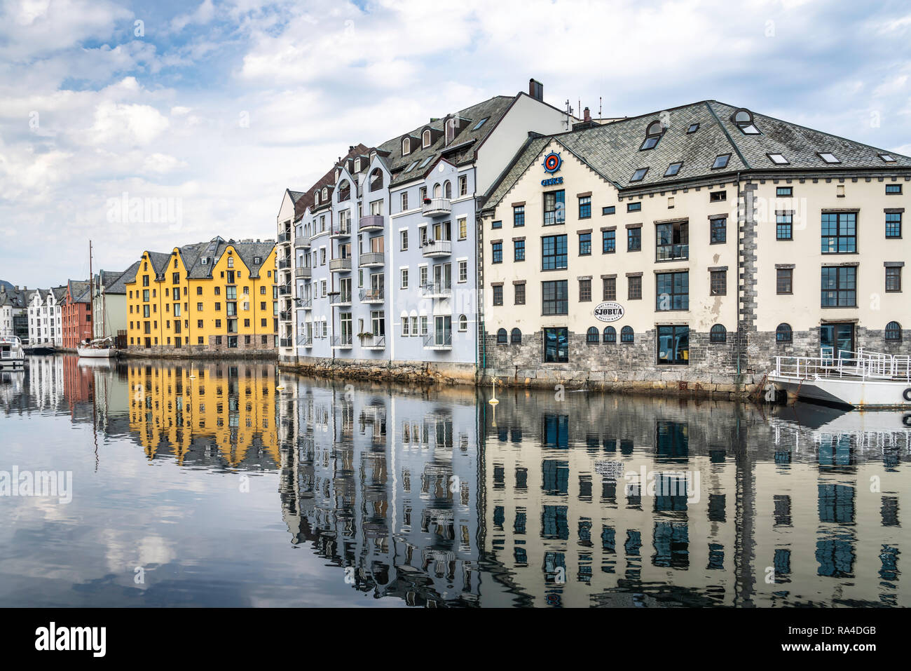 Reflections of buildings in the Art Nouveau Town of Ålesund, Norway ...