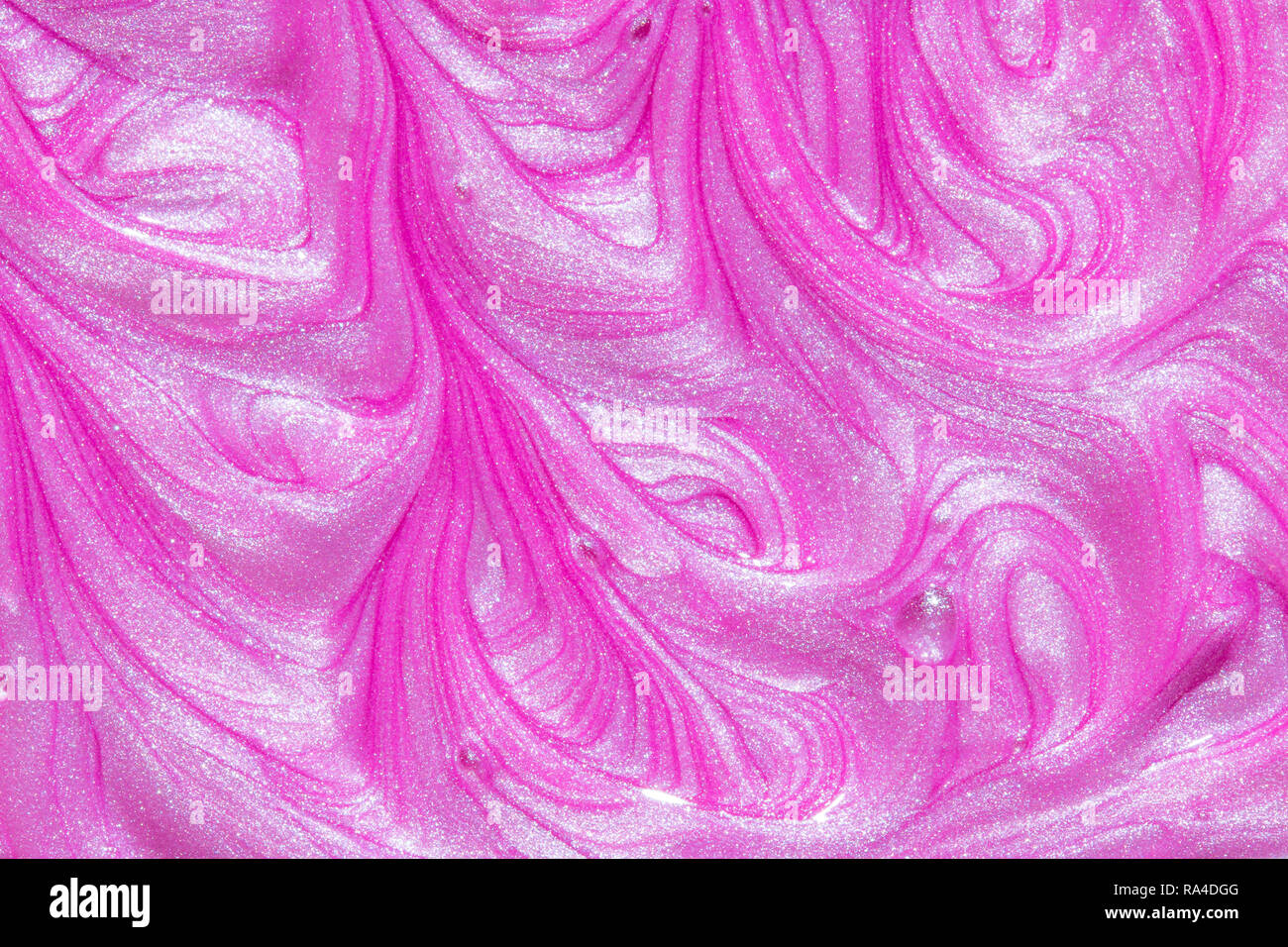 Abstract background of pink and silver metallic liquid paint swirls ...