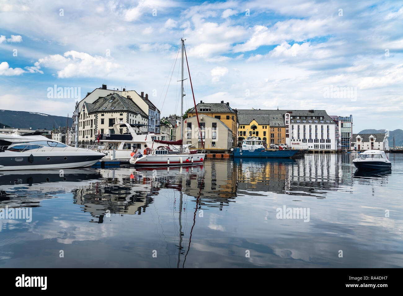 Reflections of boats and buildings in the marina and ferry docks of ...