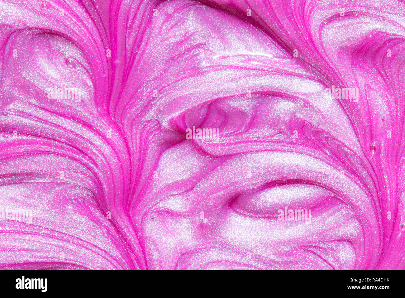 Abstract background of pink and silver metallic liquid paint swirls ...