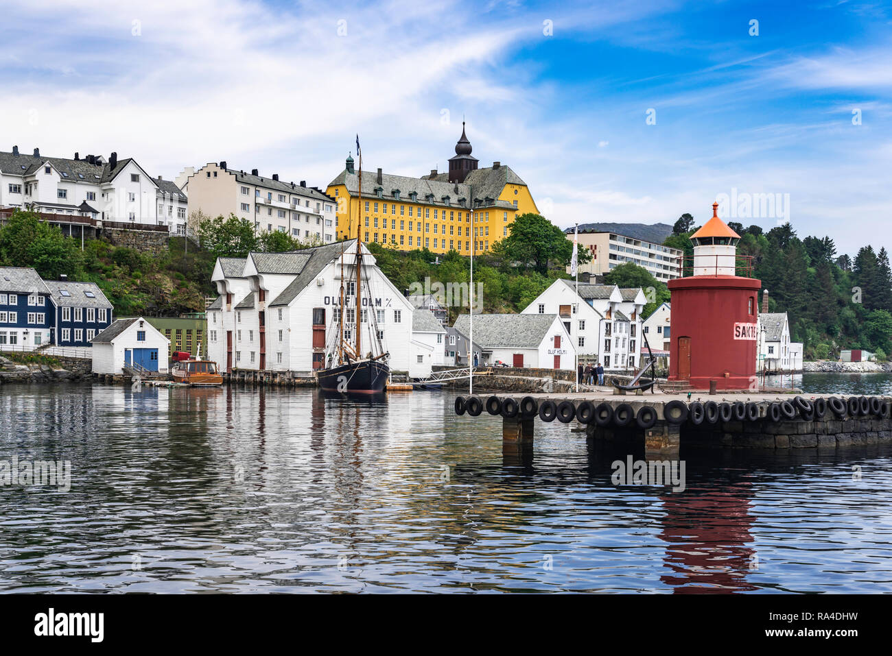 Reflections of boats and buildings in the marina and ferry docks of ...