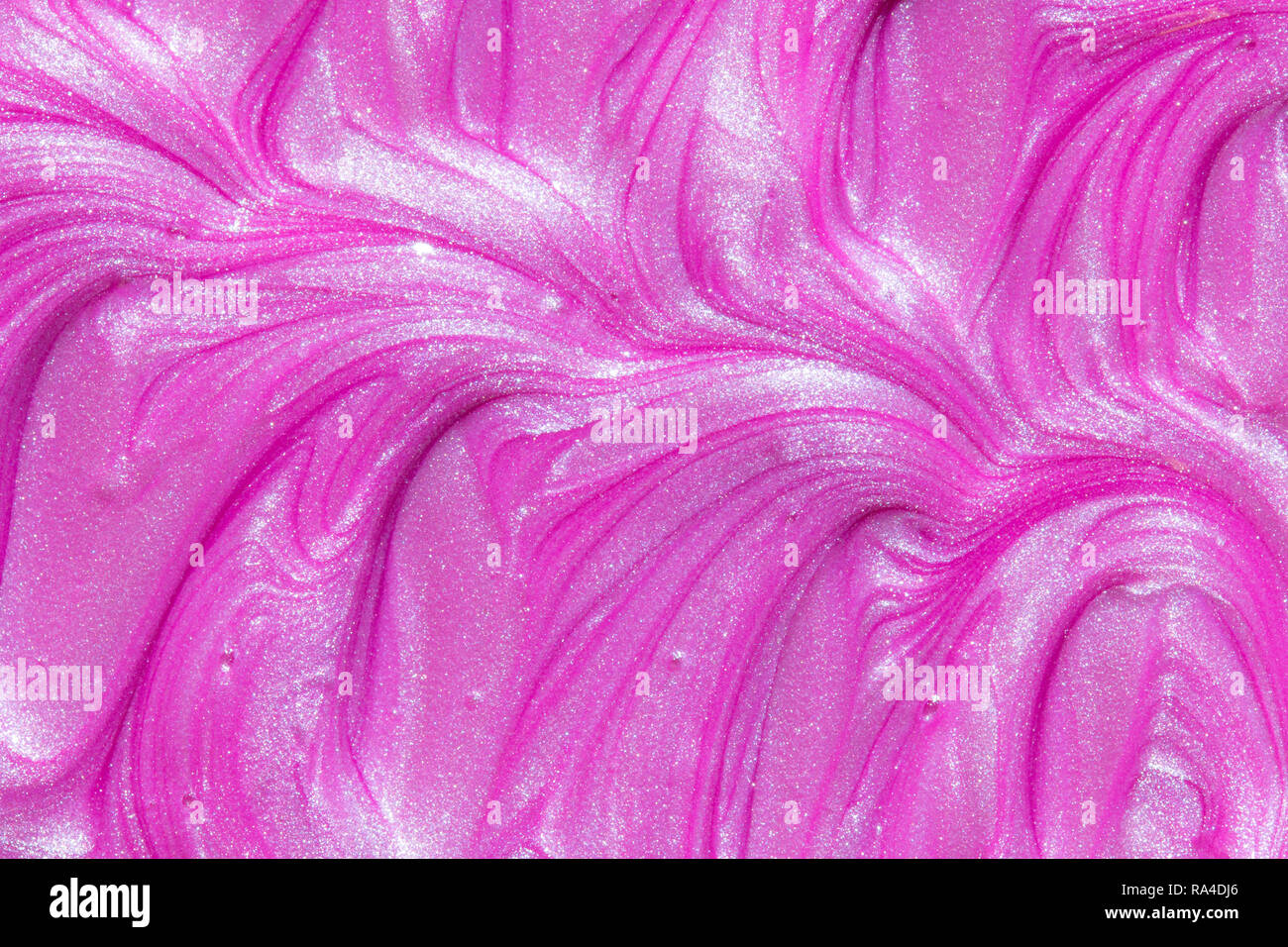 Abstract background of pink and silver metallic liquid paint swirls ...