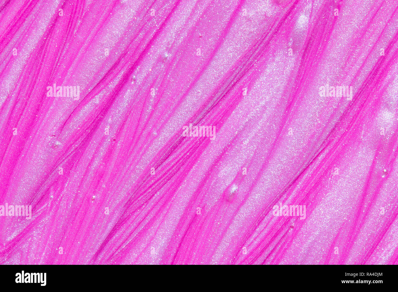 Abstract background of pink and silver metallic liquid paint swirls ...
