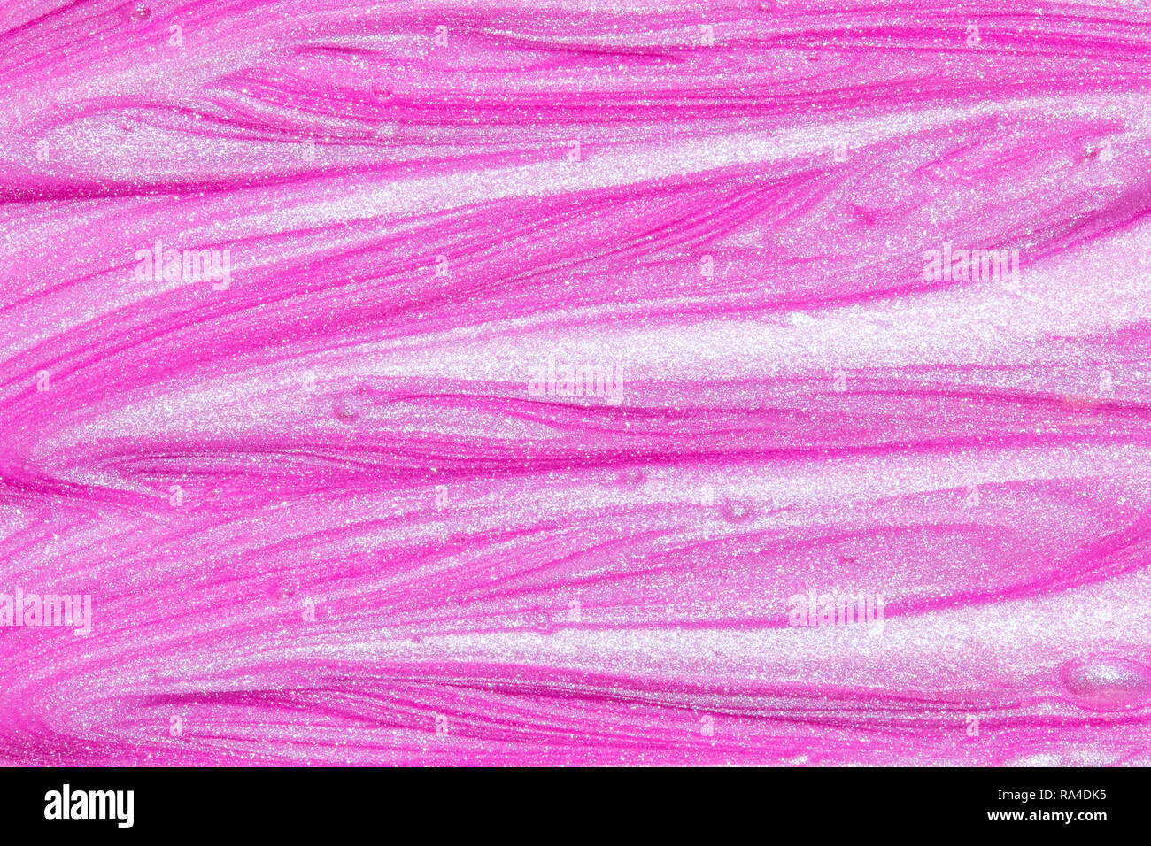 Abstract background of pink and silver metallic liquid paint swirls ...