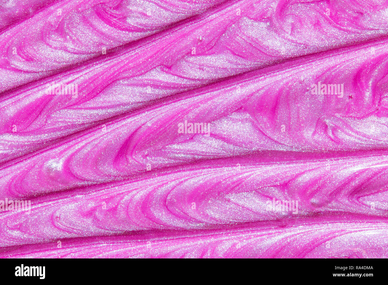 Abstract background of pink and silver metallic liquid paint swirls ...