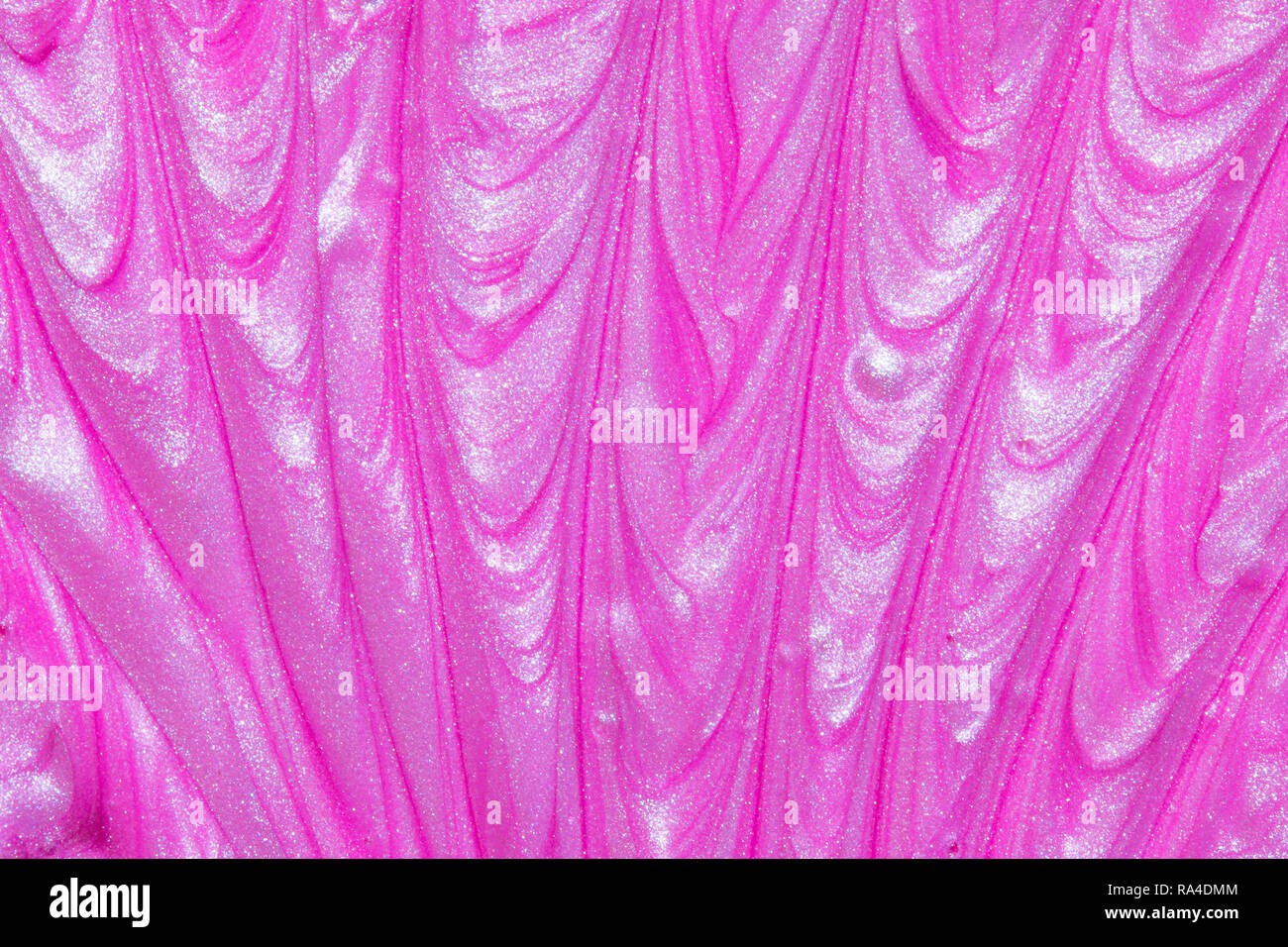 Abstract background of pink and silver metallic liquid paint swirls ...