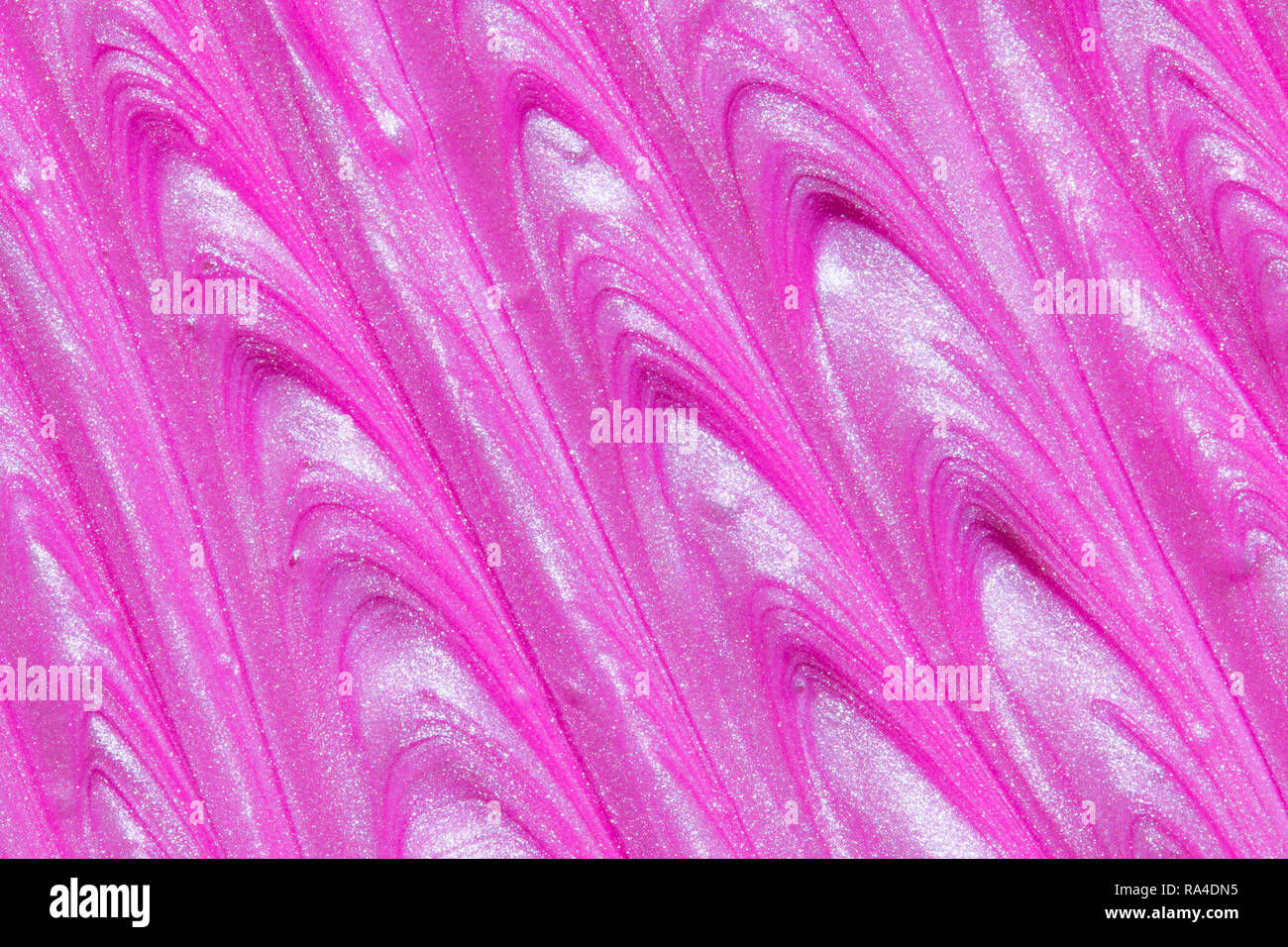 Abstract background of pink and silver metallic liquid paint swirls ...