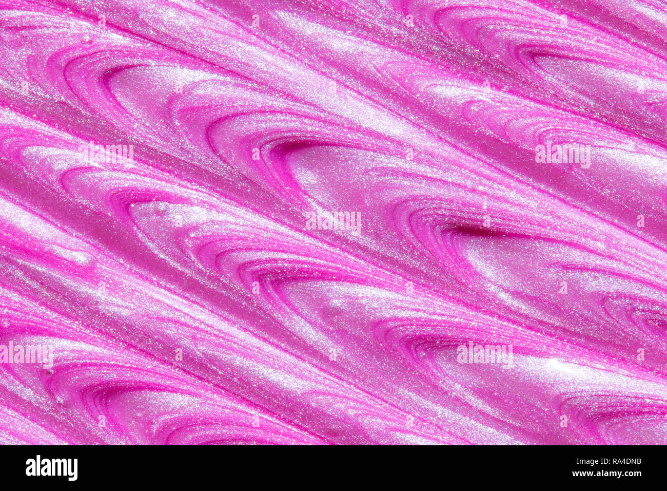 Abstract background of pink and silver metallic liquid paint swirls ...